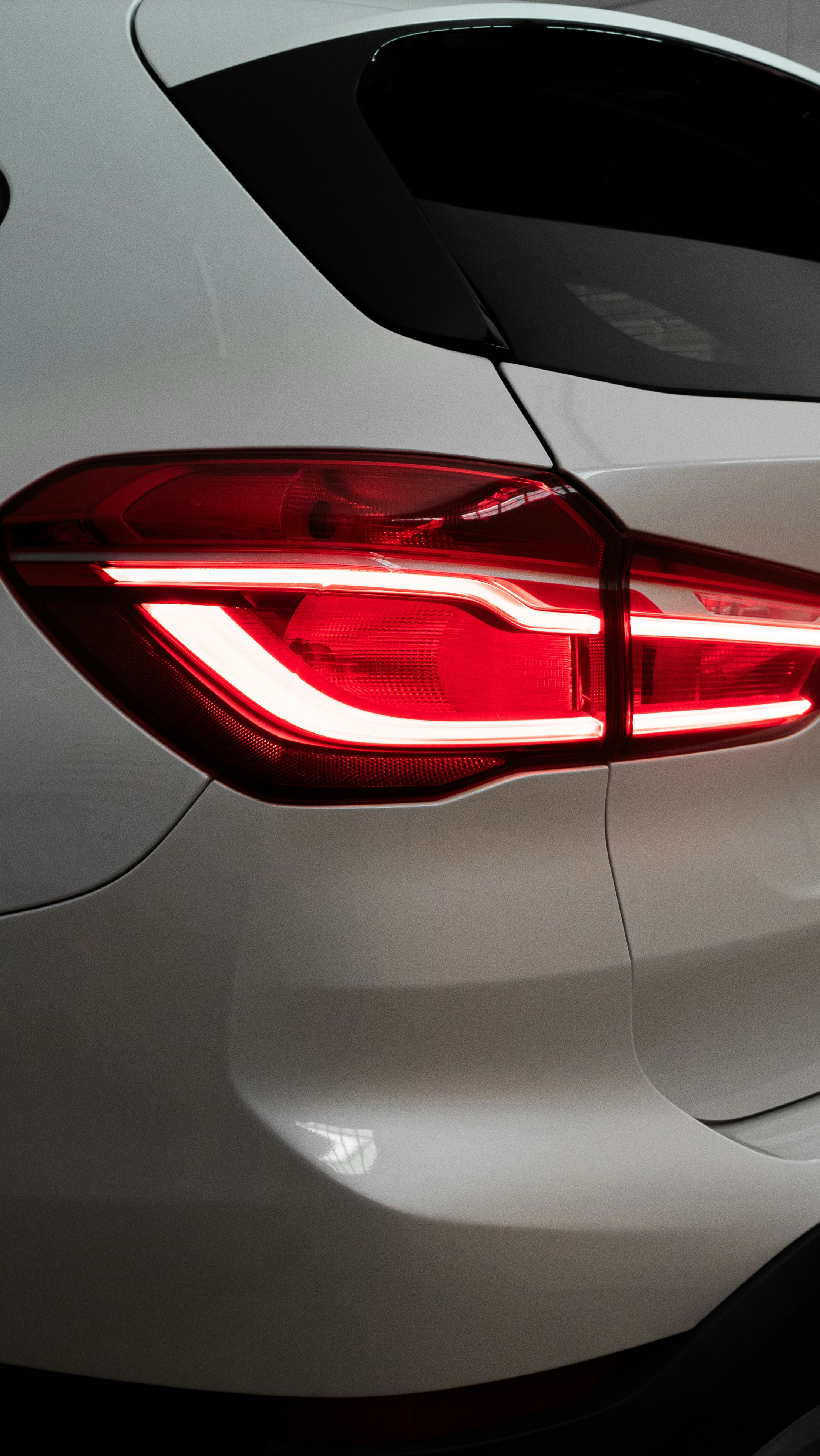 Hidden Power: The Tail Light's Sculpted Curve on a Silver SUV