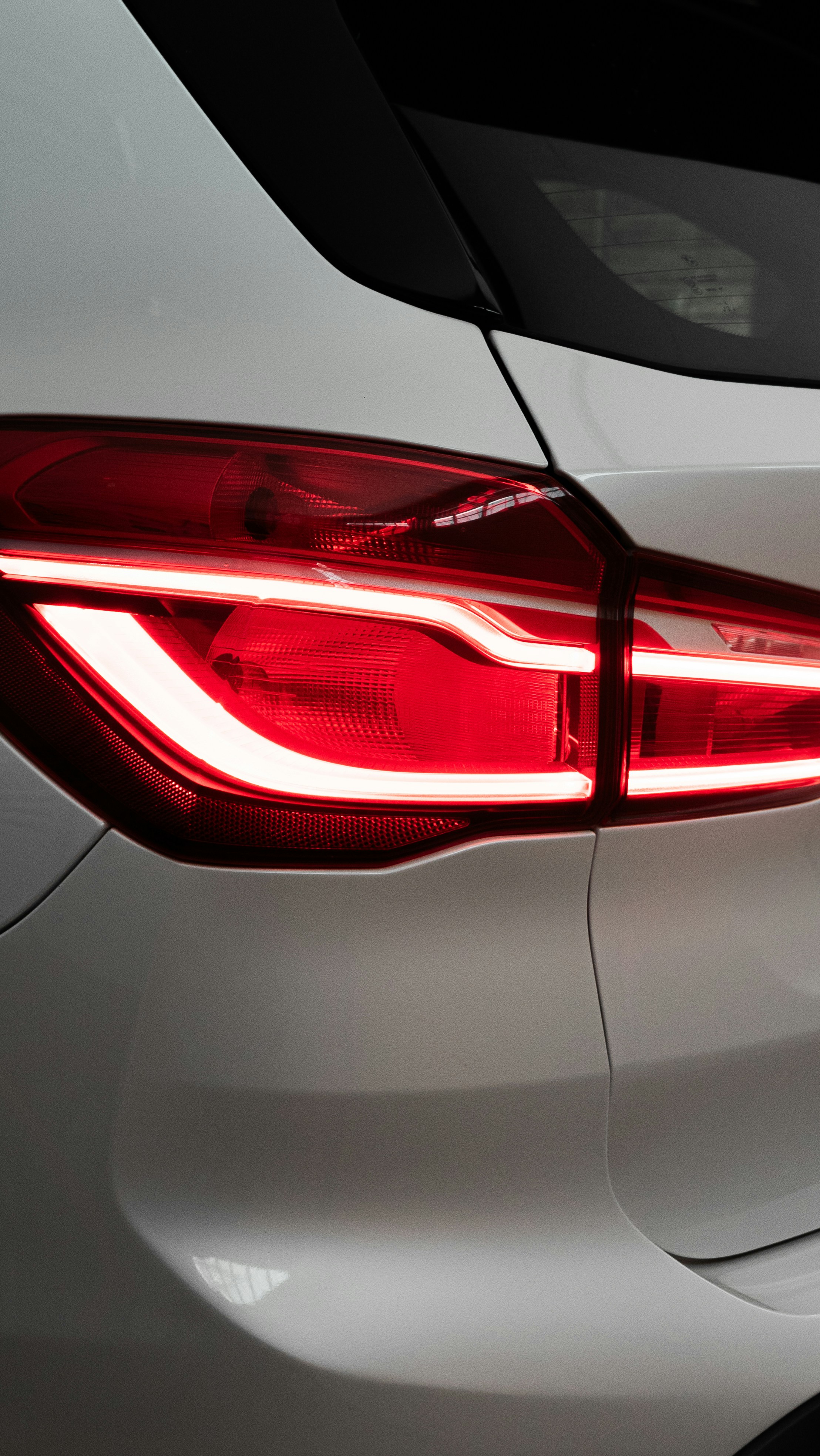 Rear Light Study: Crimson Arc on Carbon-gray Body