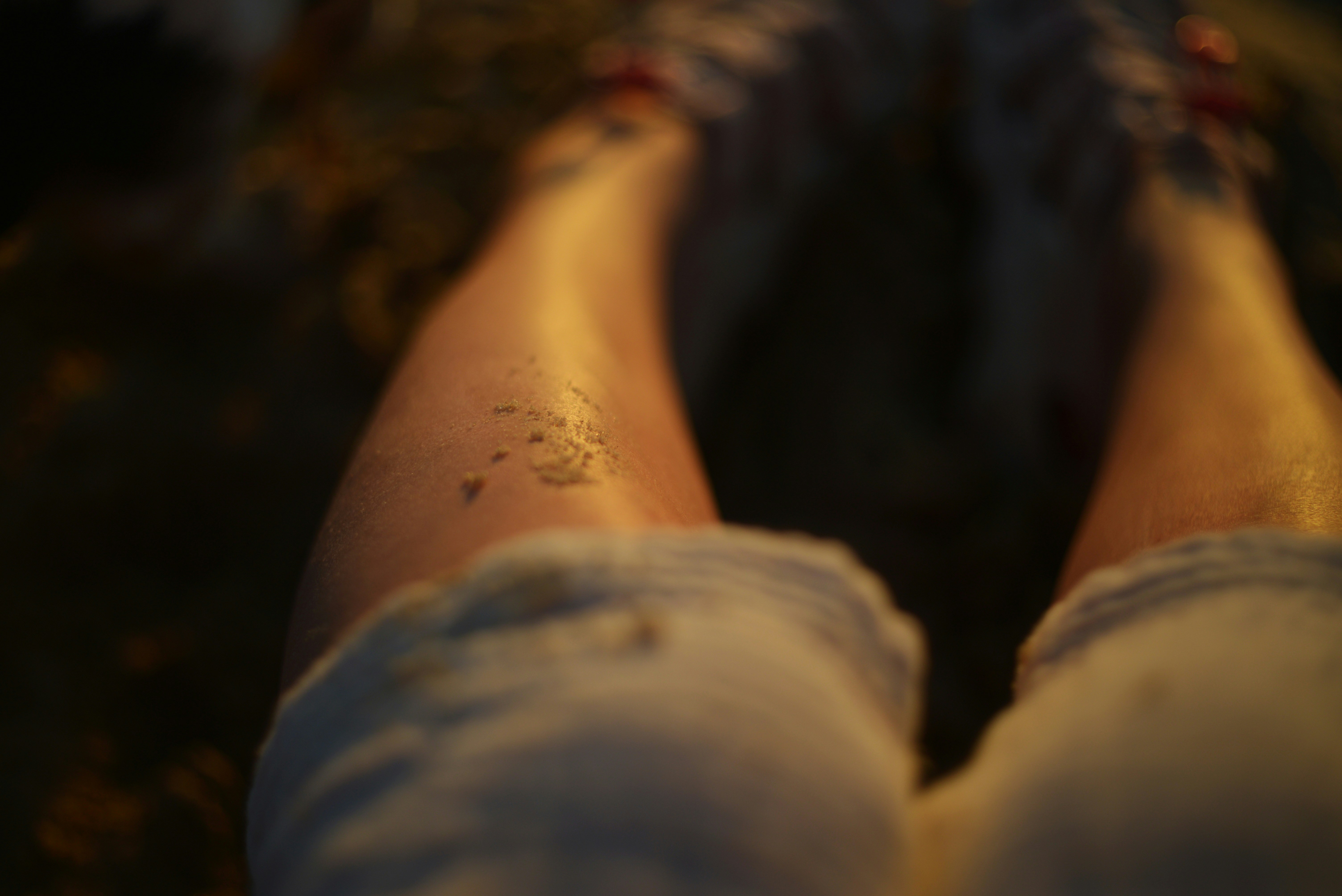 Feet Over The Edge: A Distant Perspective of Sandal Strands