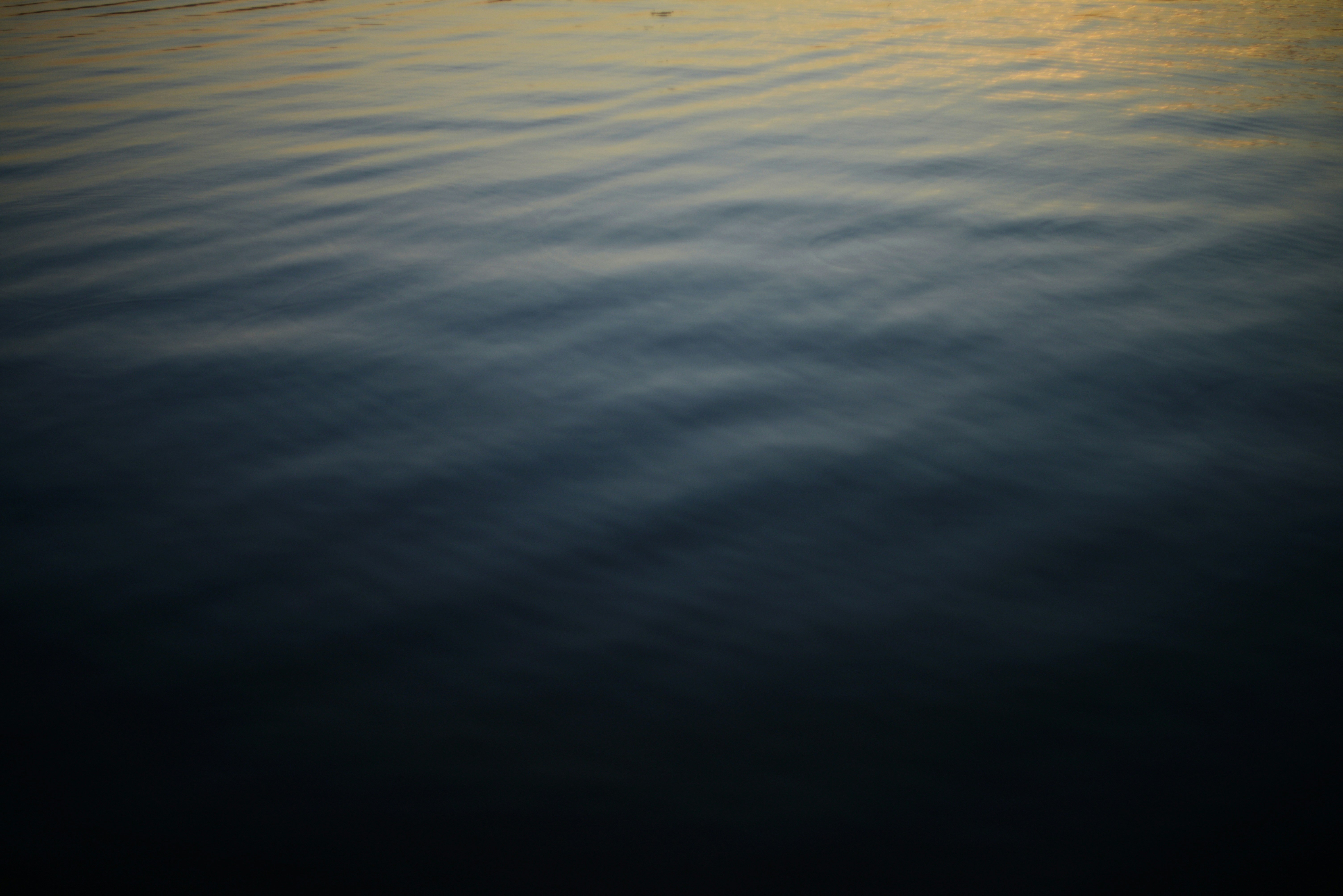 Golden Rim at Dusk Over Quiet Water