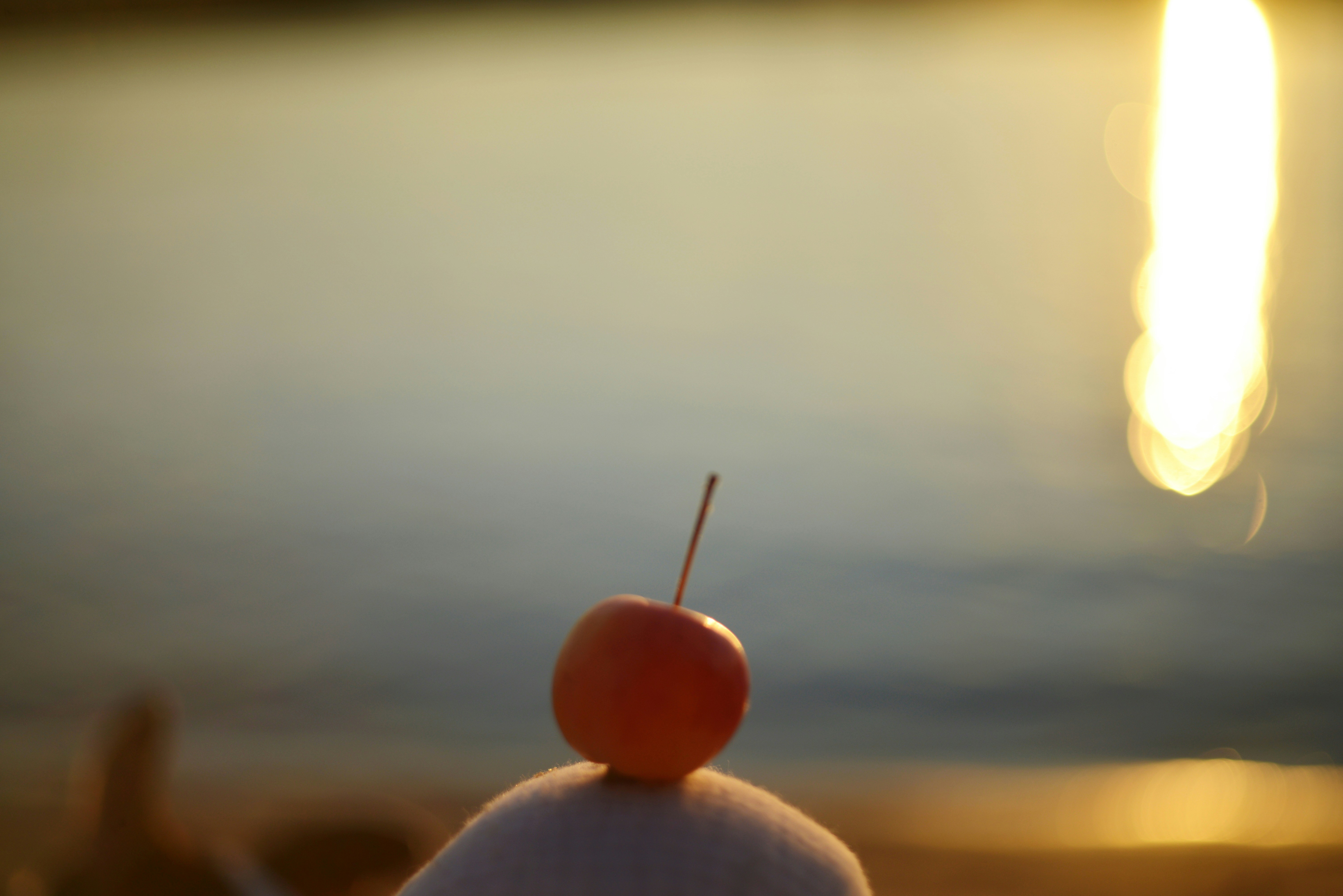 Cherry on Snow: A Quiet Sunset Snack at Water's Edge