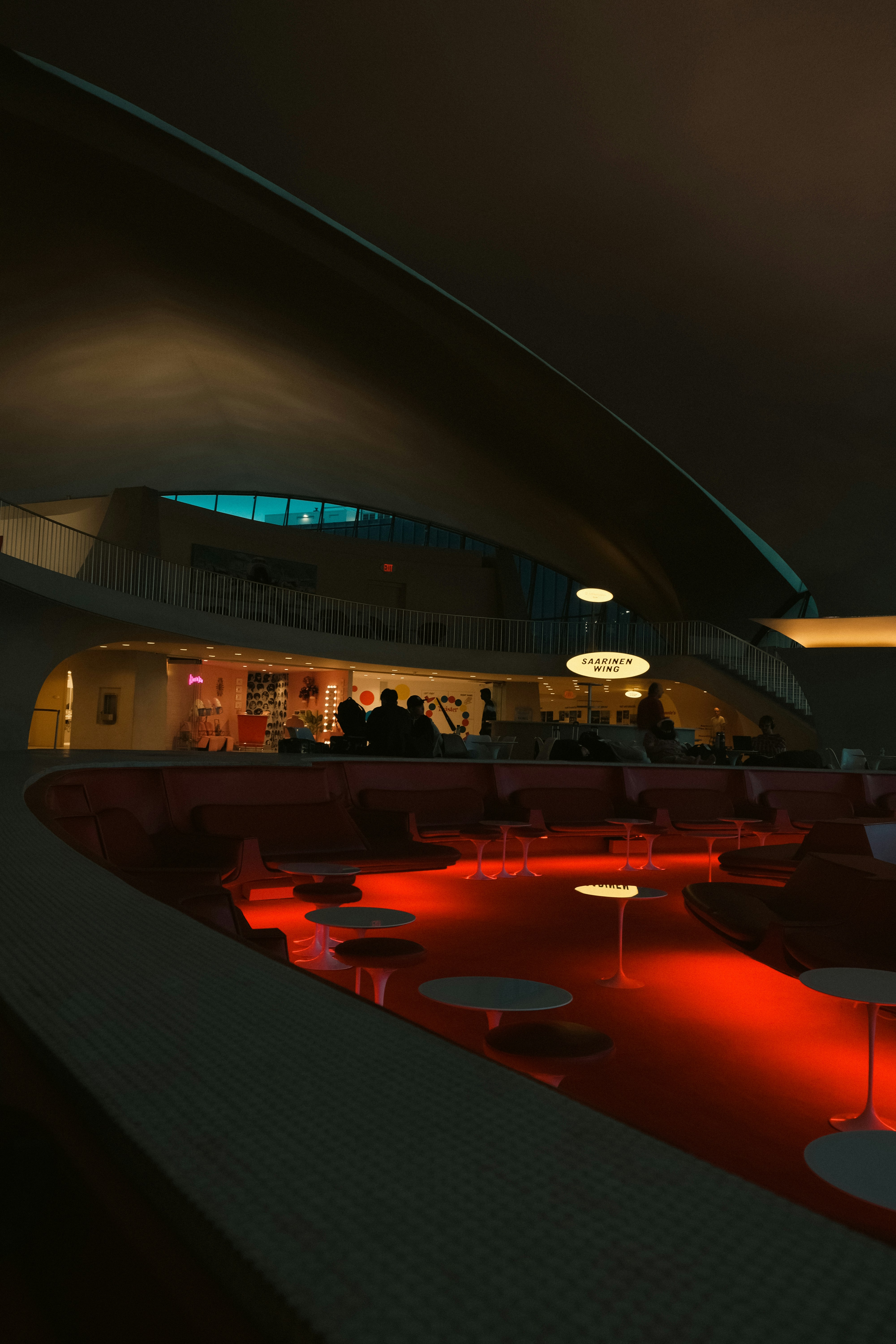 Midnight Lounge: Red Glow Over Quiet Circulation