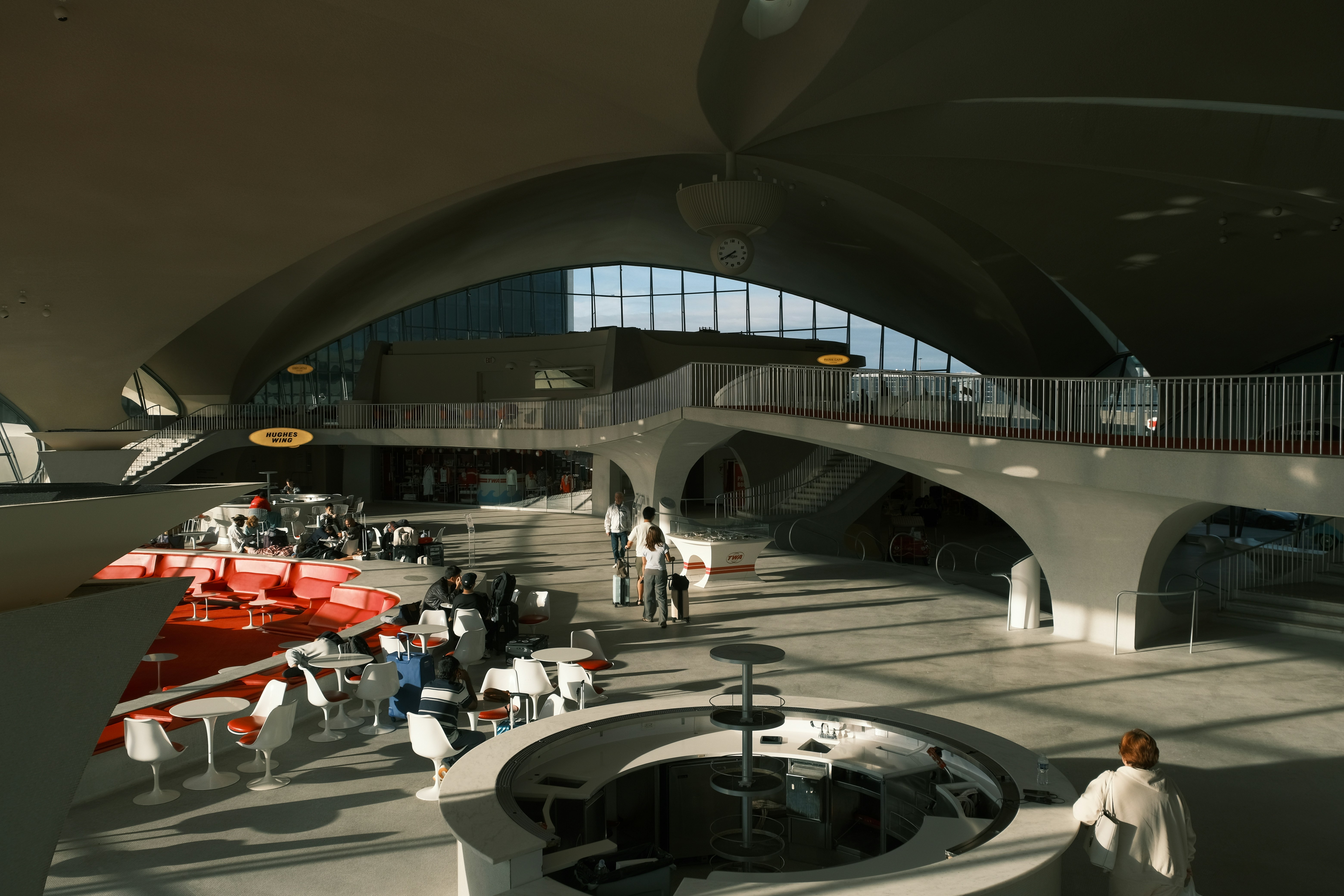 Underside of a Futurist Atrium: Circular Lounge beneath a Curved Ceiling
