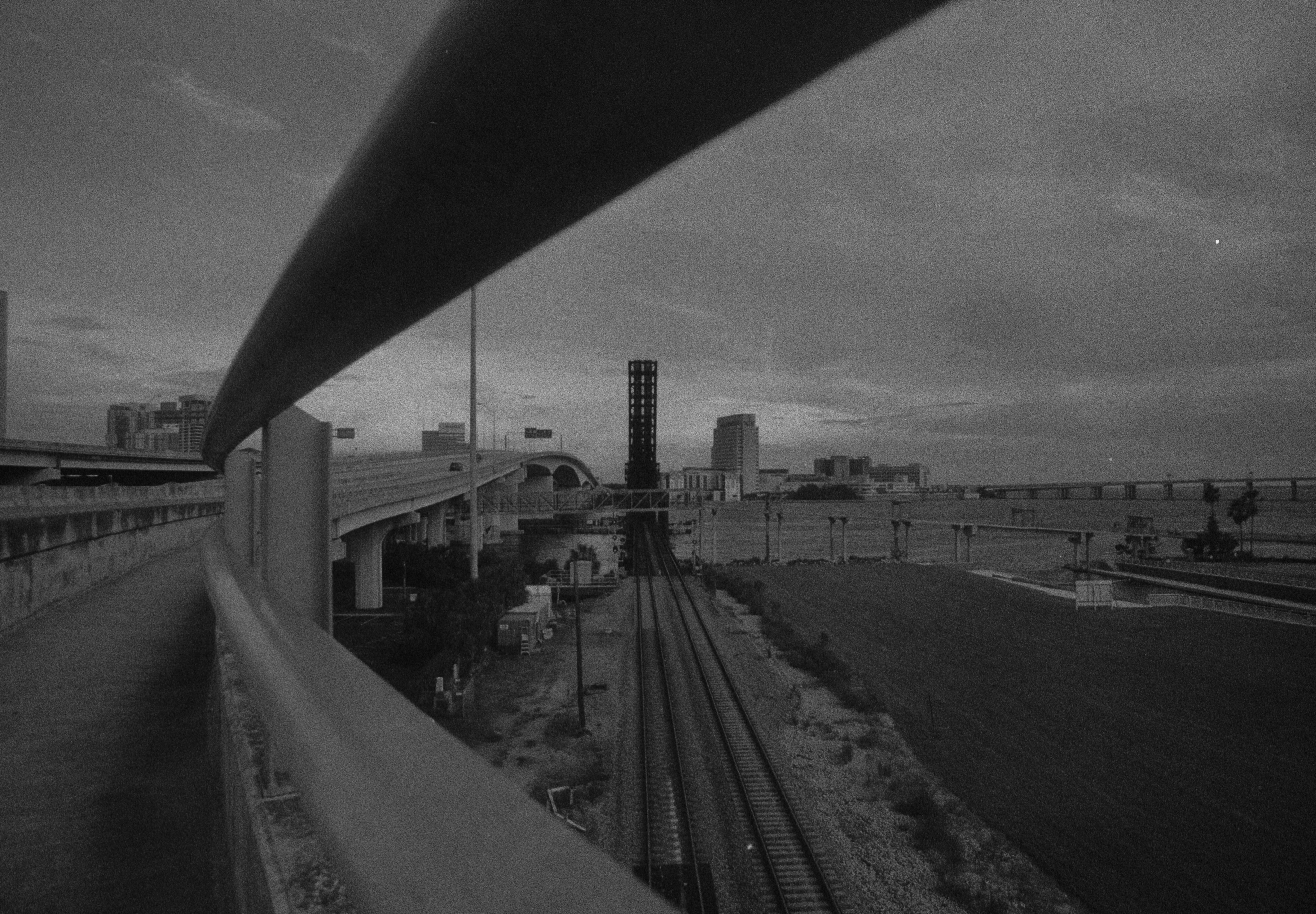 Ribbed Skyline: A Rail Bridge Horizon in Monochrome