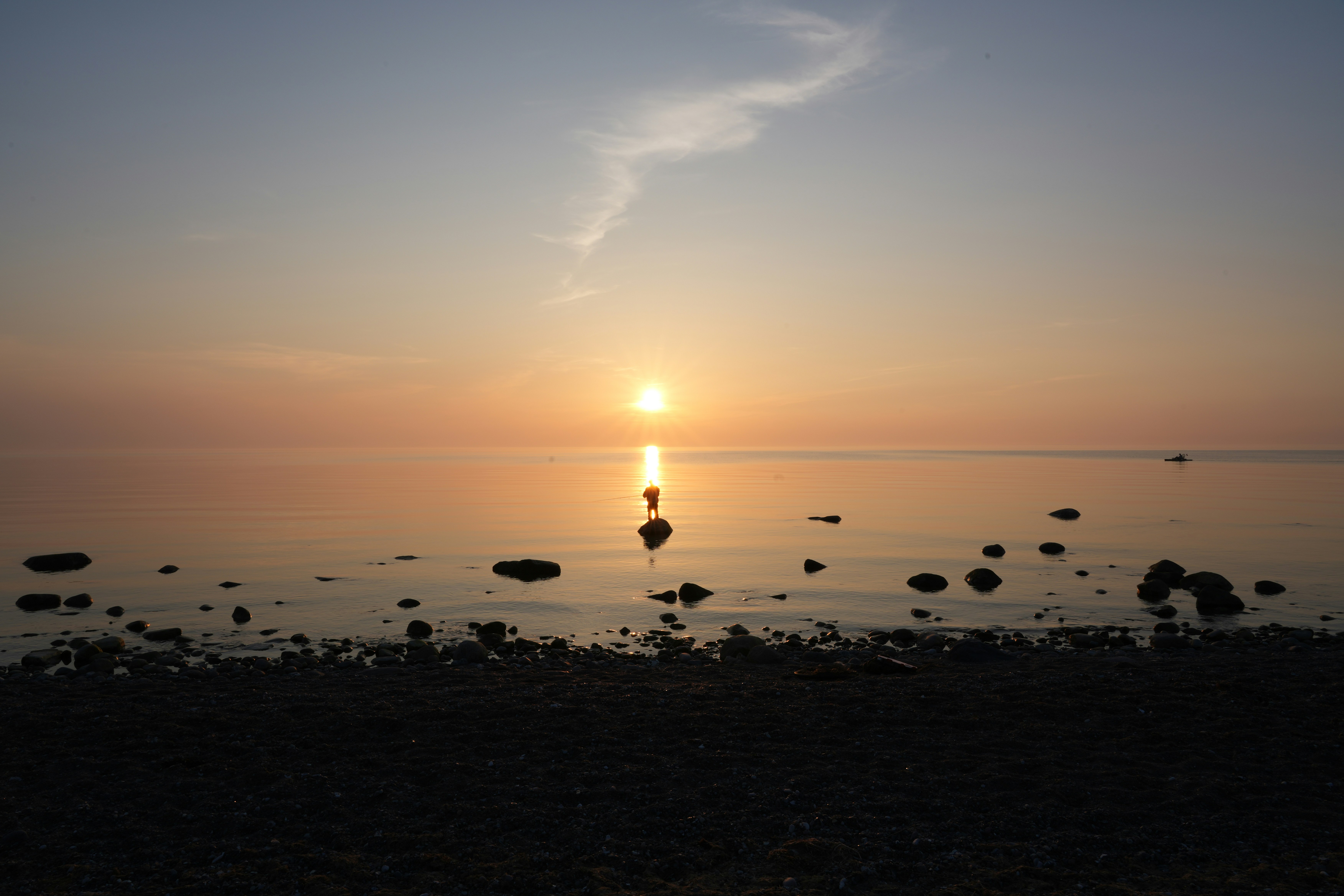 Quiet Horizon: A Sunlit Solitude Over Calm Waters