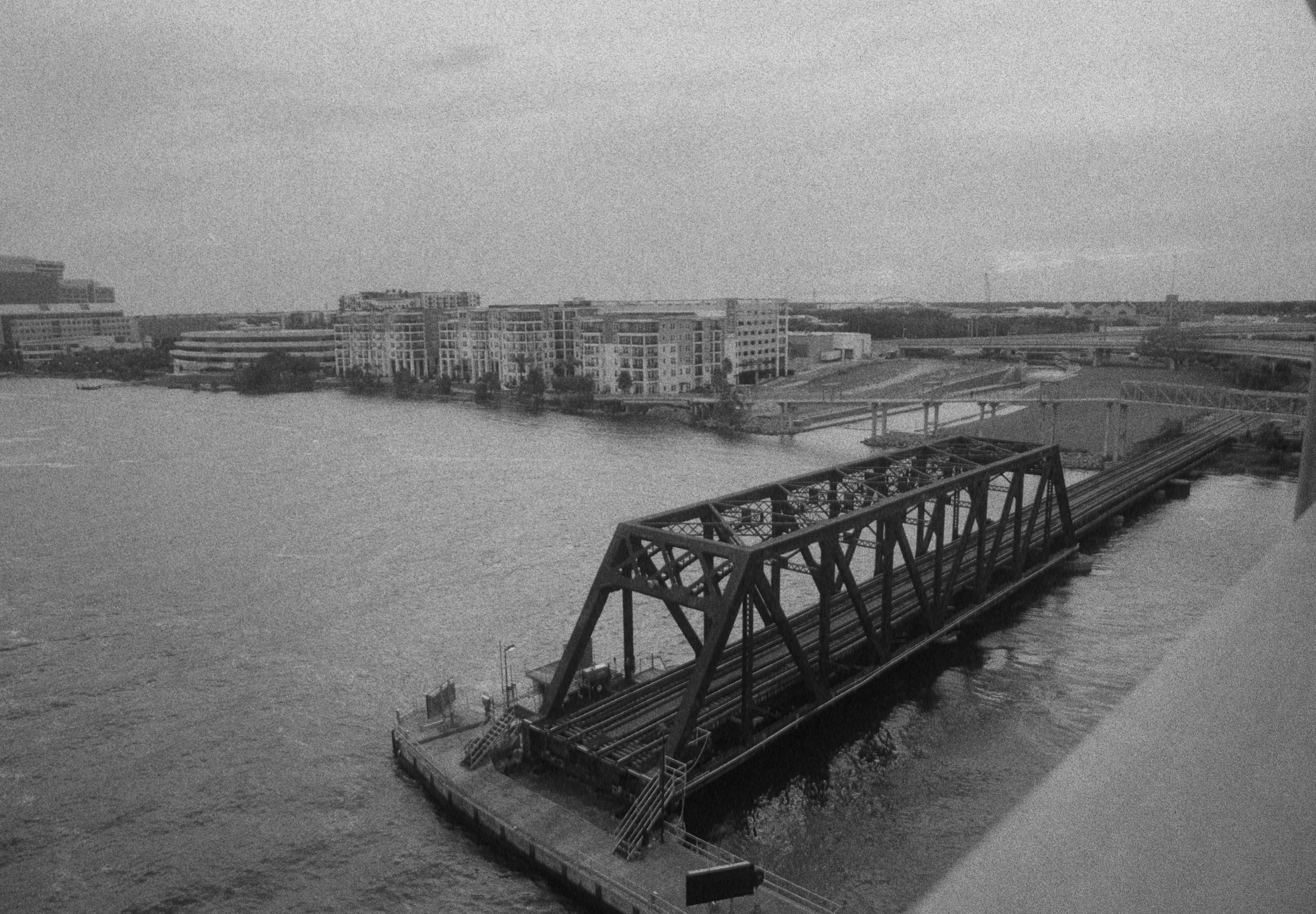 Industrial River Spine: A Desaturated Bridge Layout
