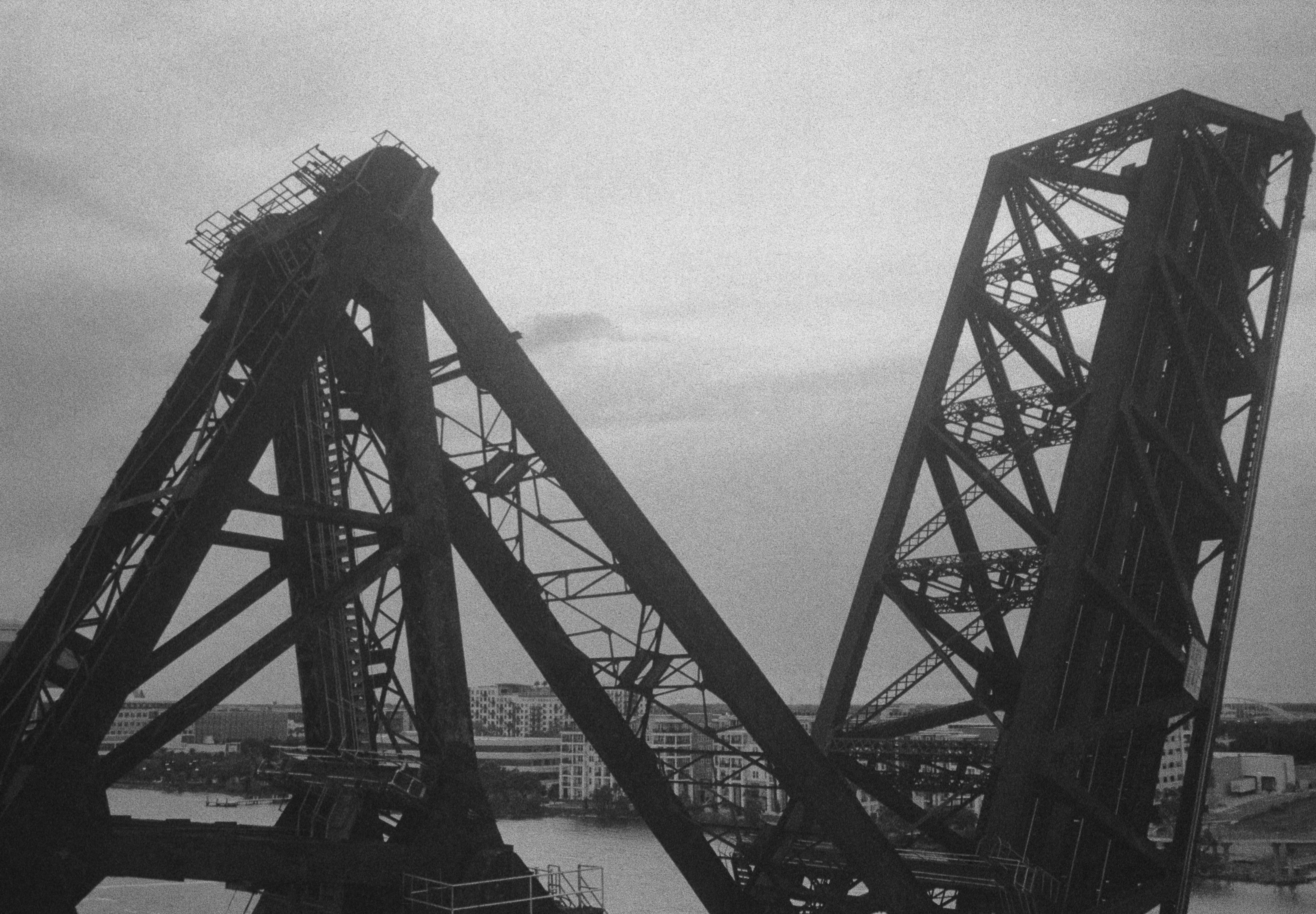 Rusted Triangles: A Collapsed Girder Bridge Framing the Sky