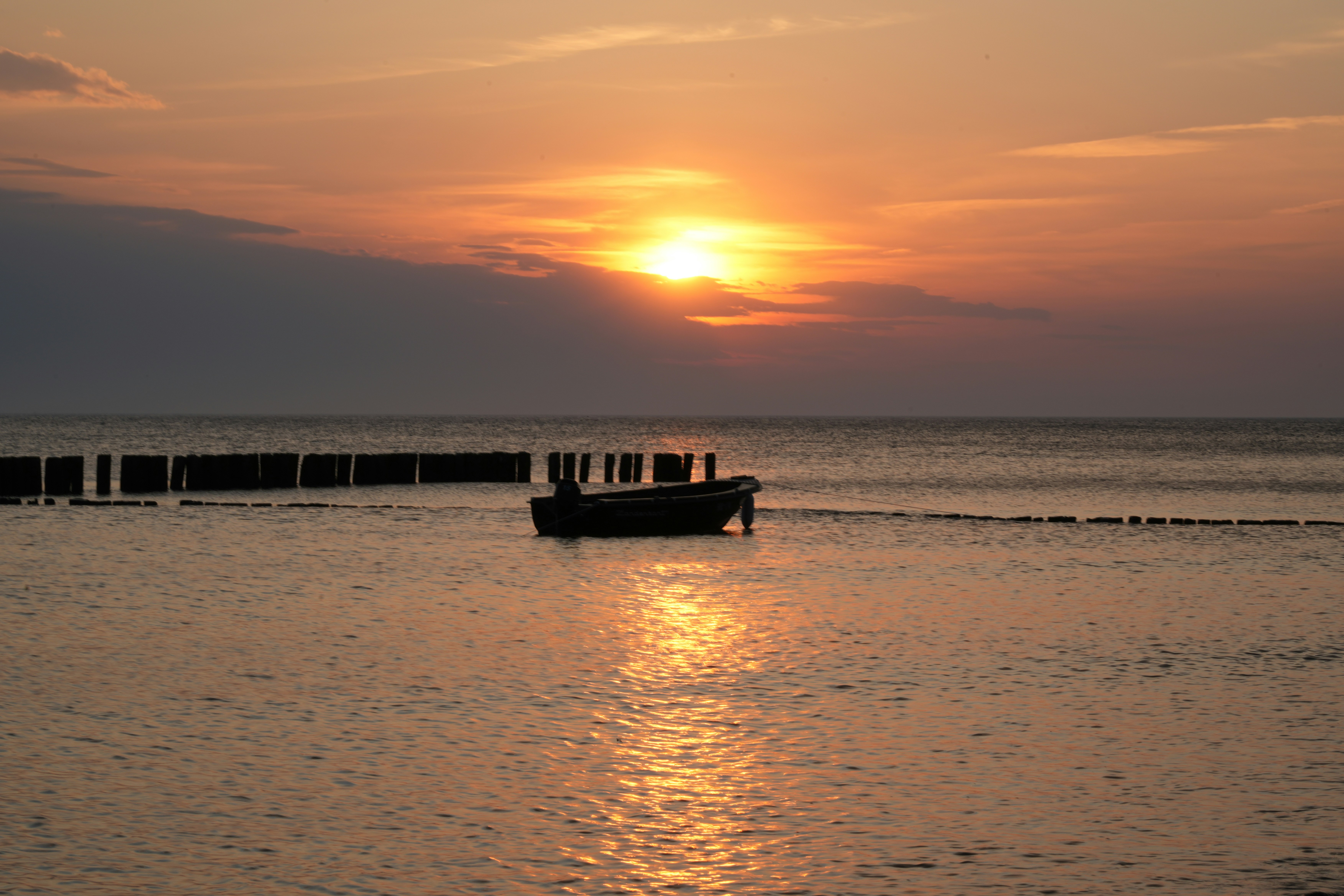 Silent Boat at Sunset: A Horizon of Quiet Gold