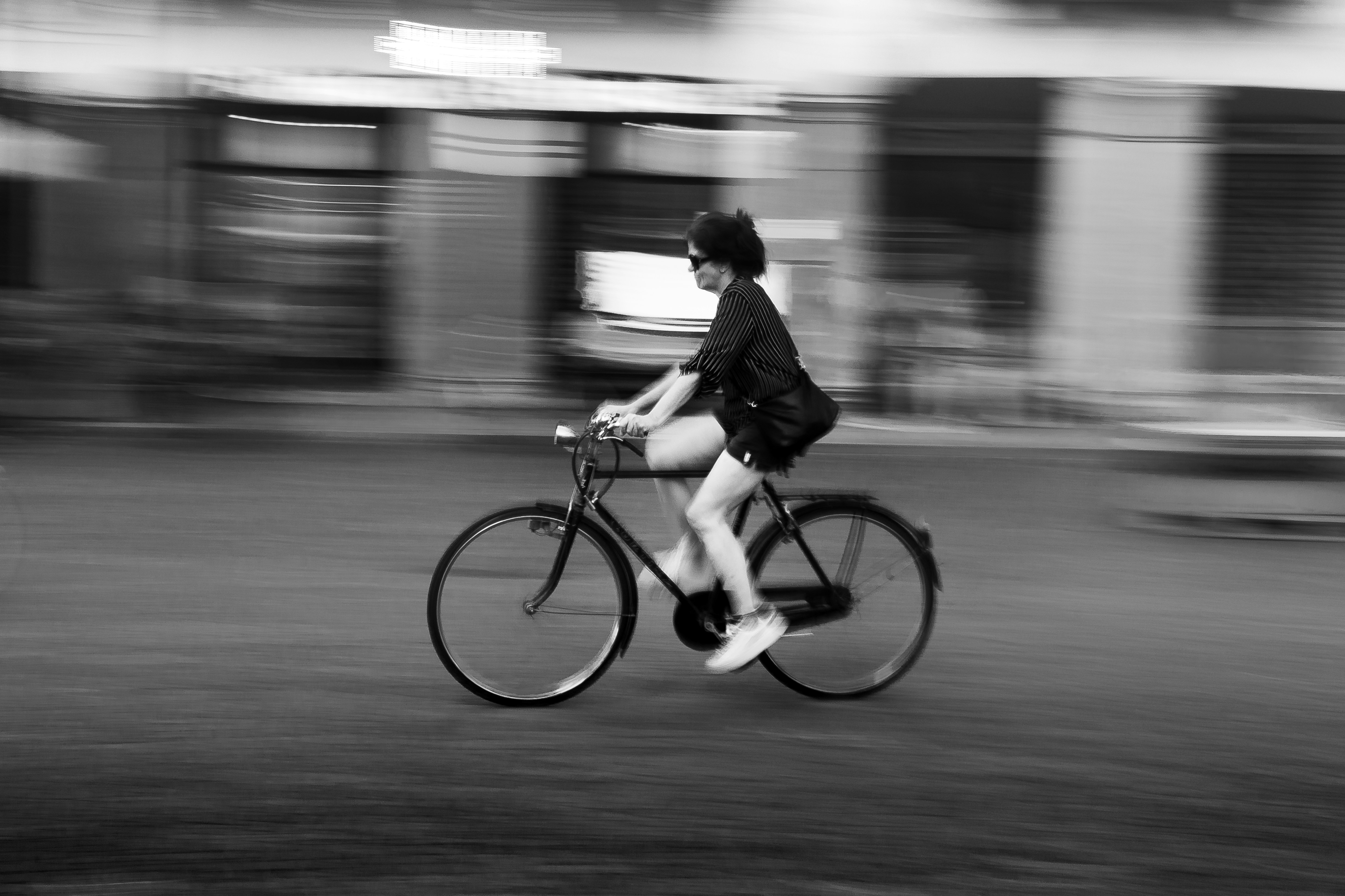 Laboring through the City: a lone cyclist in motion blur