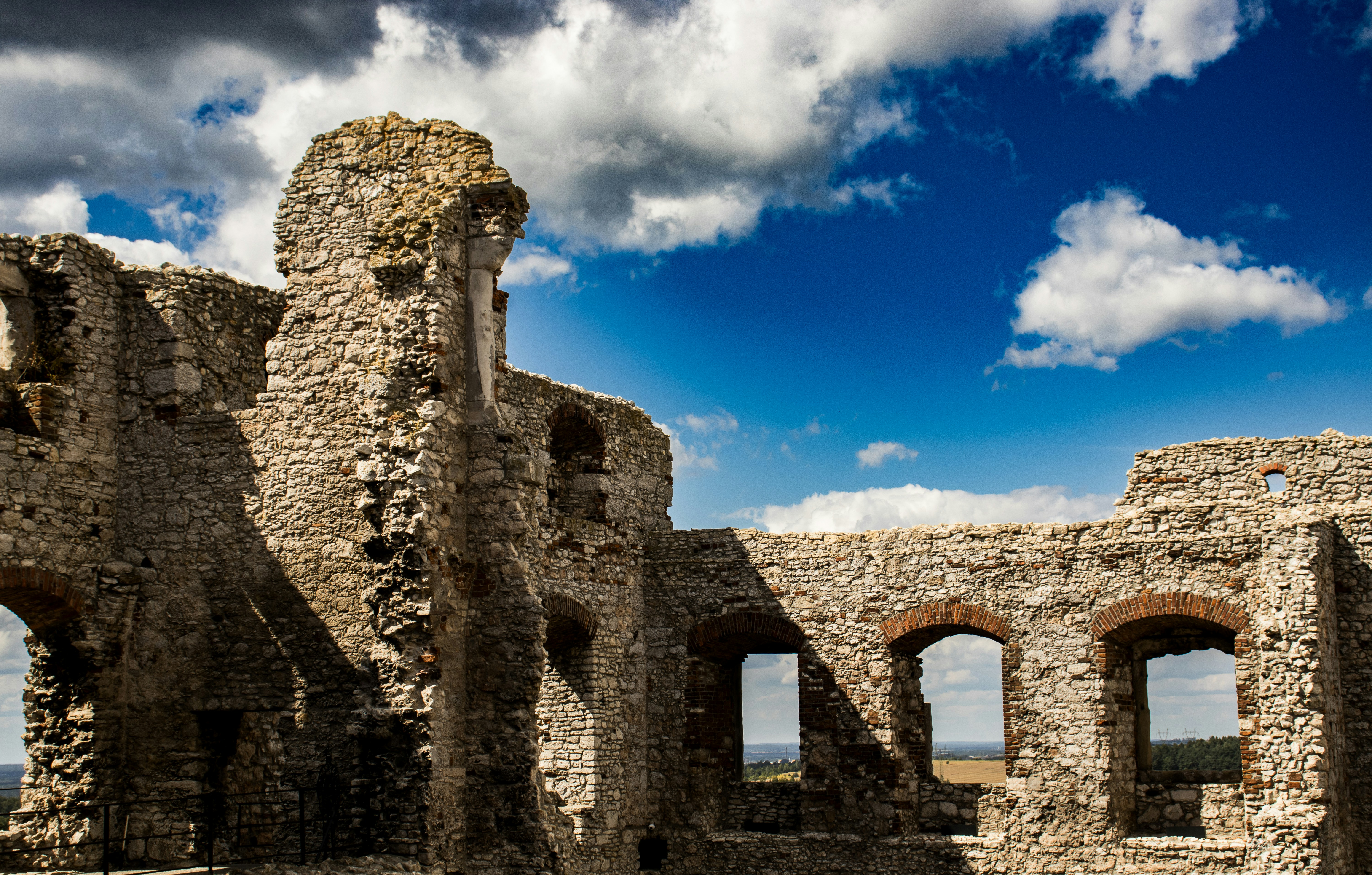Remnant Courtyard: Sunlit Arches Against a Blue Sky