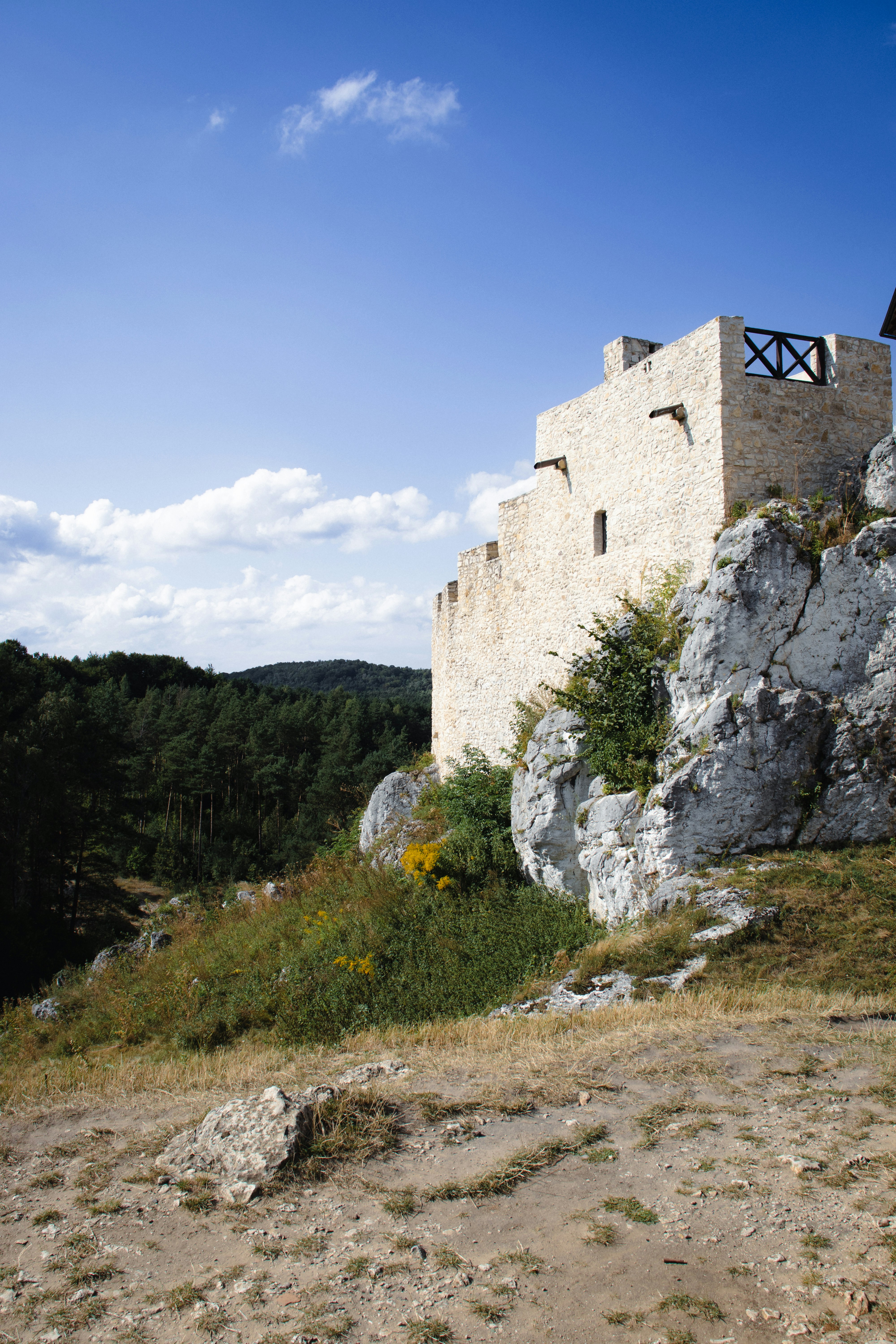 Stone Bastion on the Cliff: A Fortress Embraced by Sky and Field
