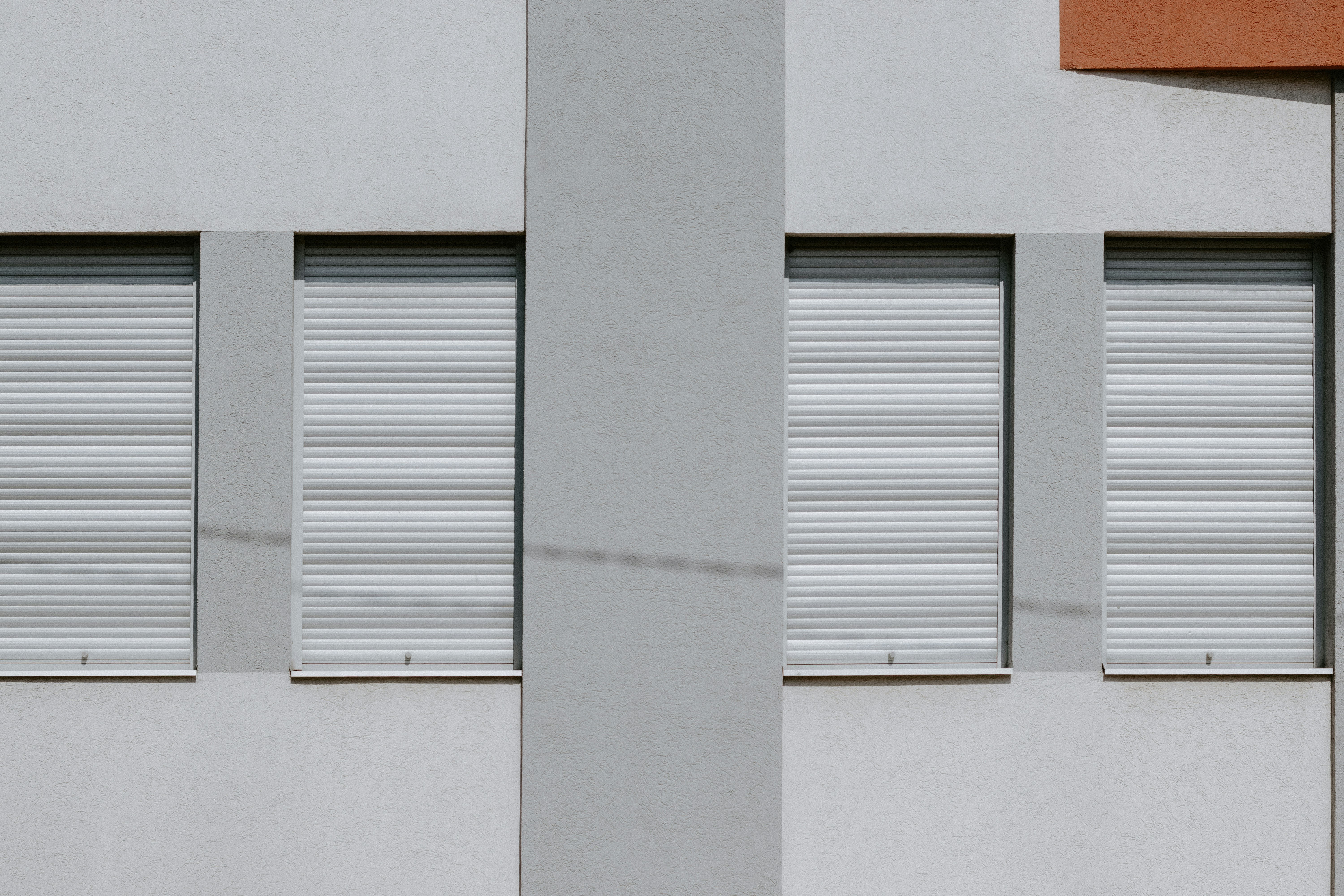 Concrete Symmetry: A Facade of Tabs and Shadows