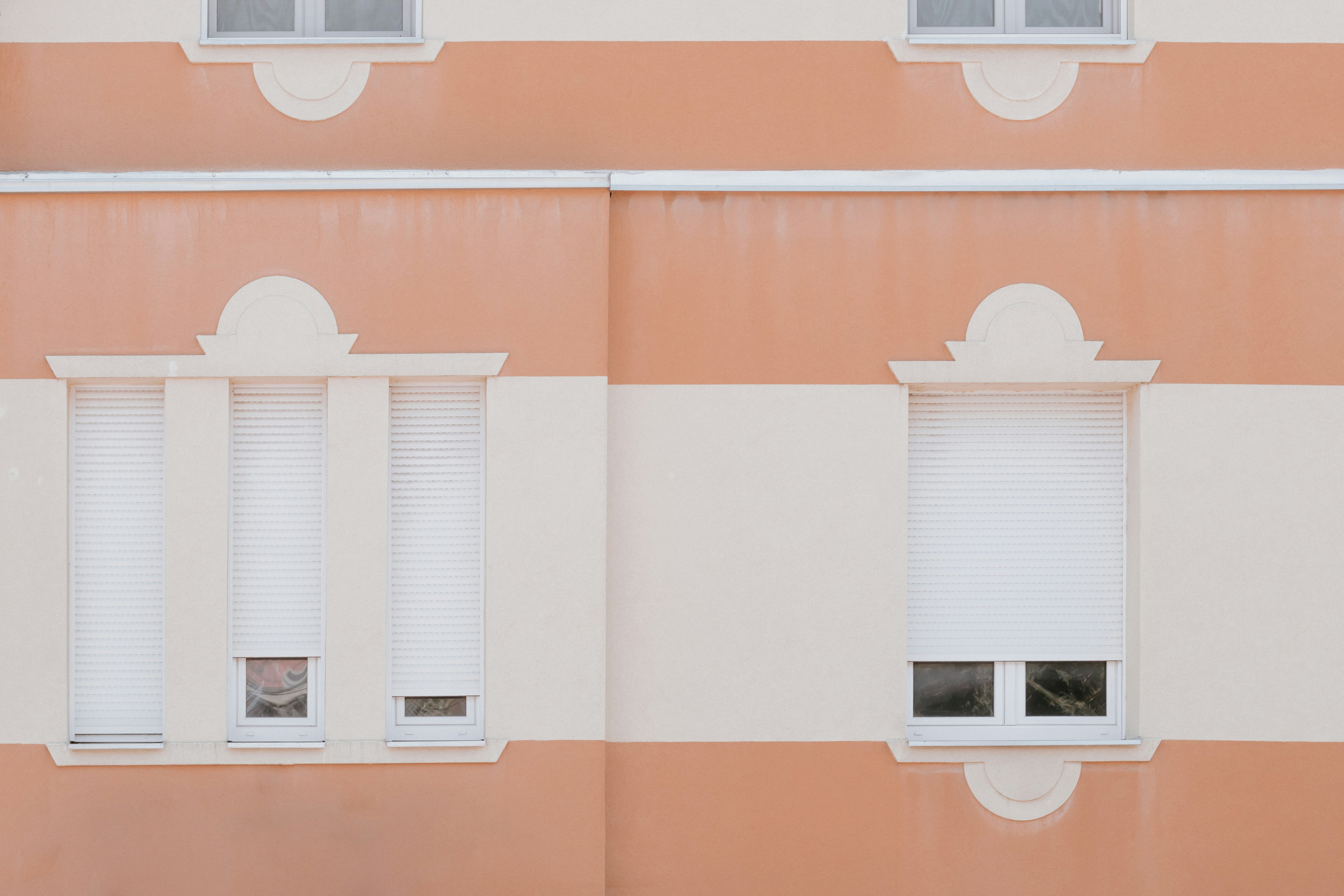 Hidden Eye in the Peach Facade