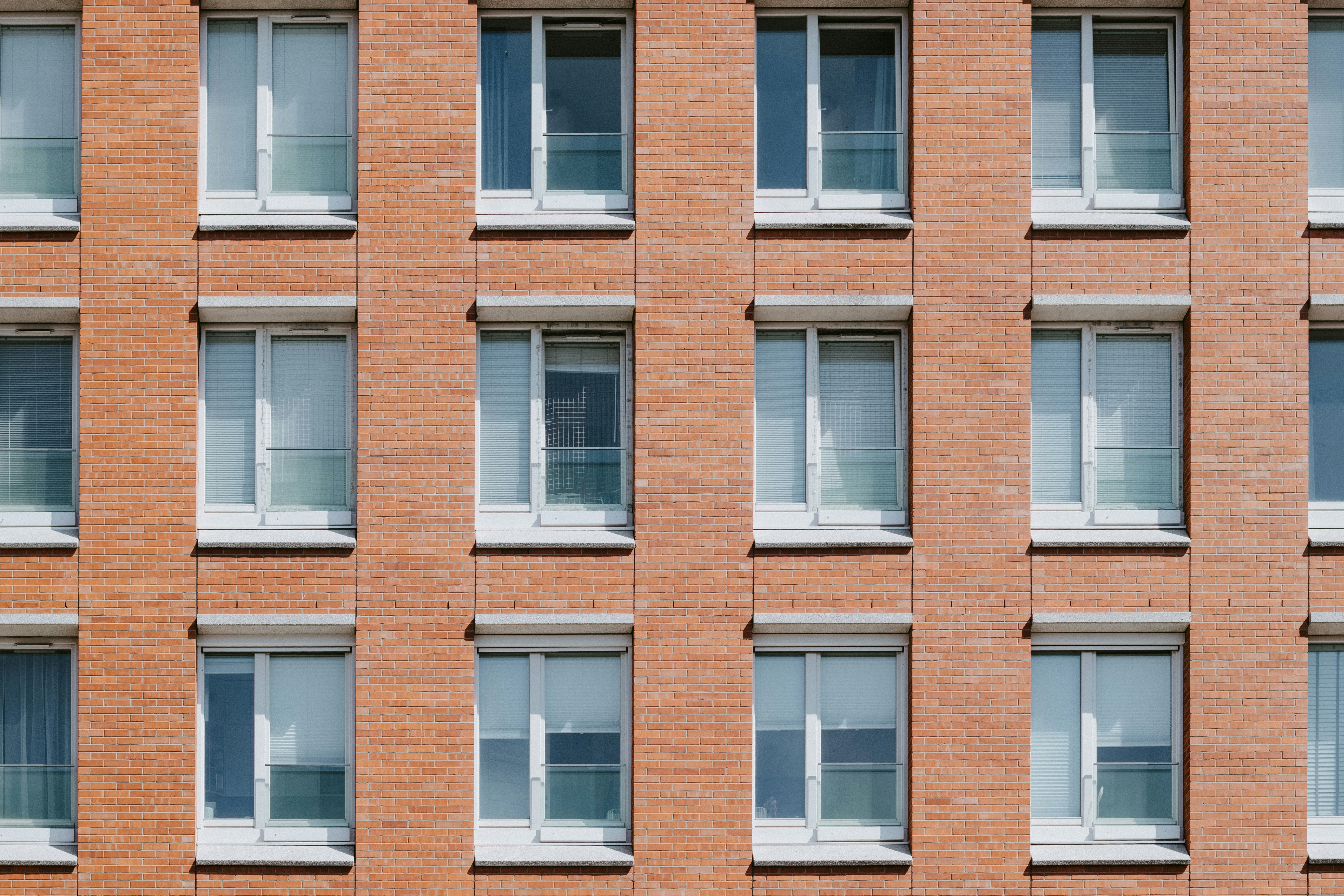 Brick Facade Rhythm: A Grid of Windows
