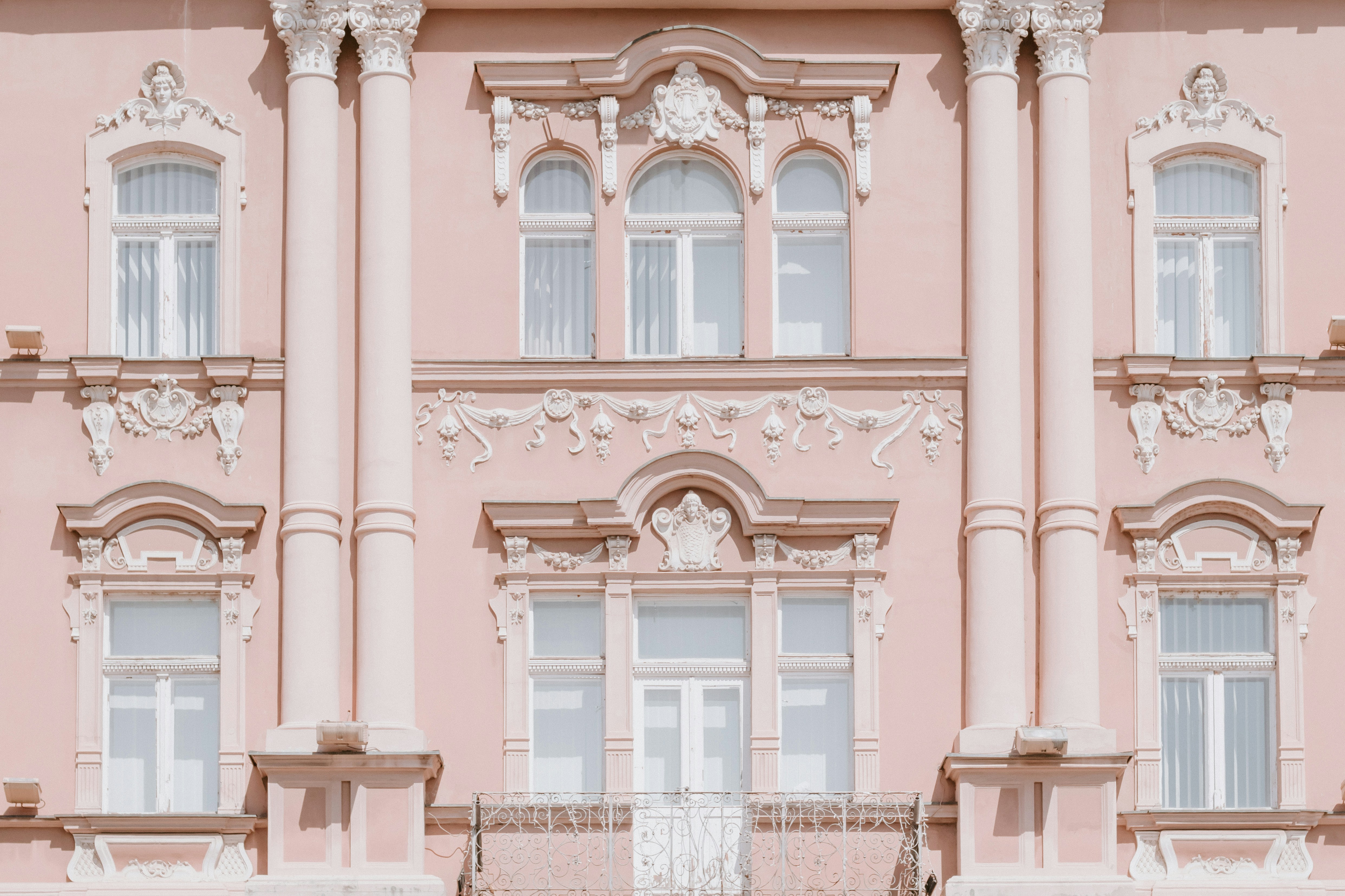 Symmetrical Facade in Soft Coral Light