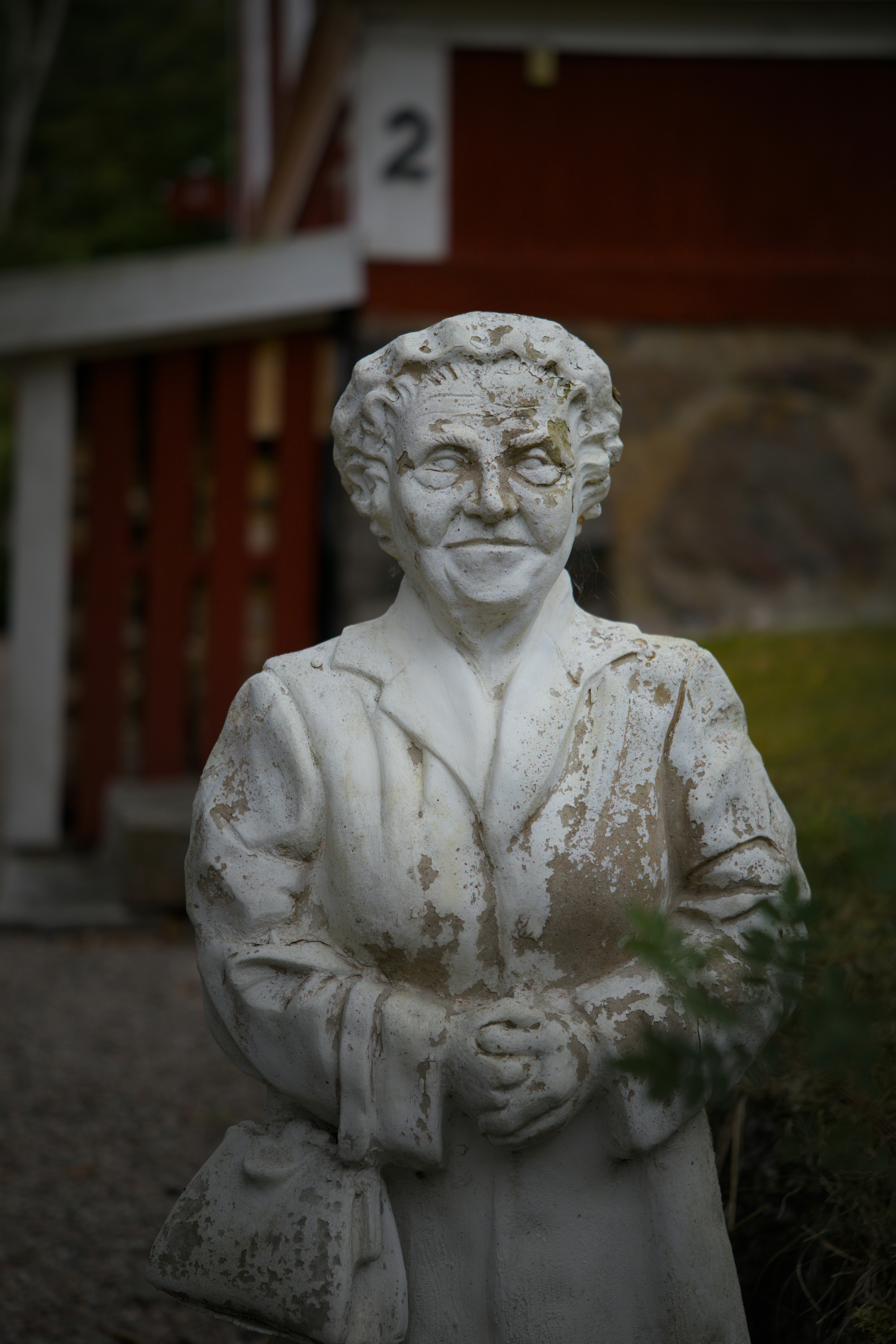 Stoic Marble: A Quiet Statue Beneath a Warped Shadow