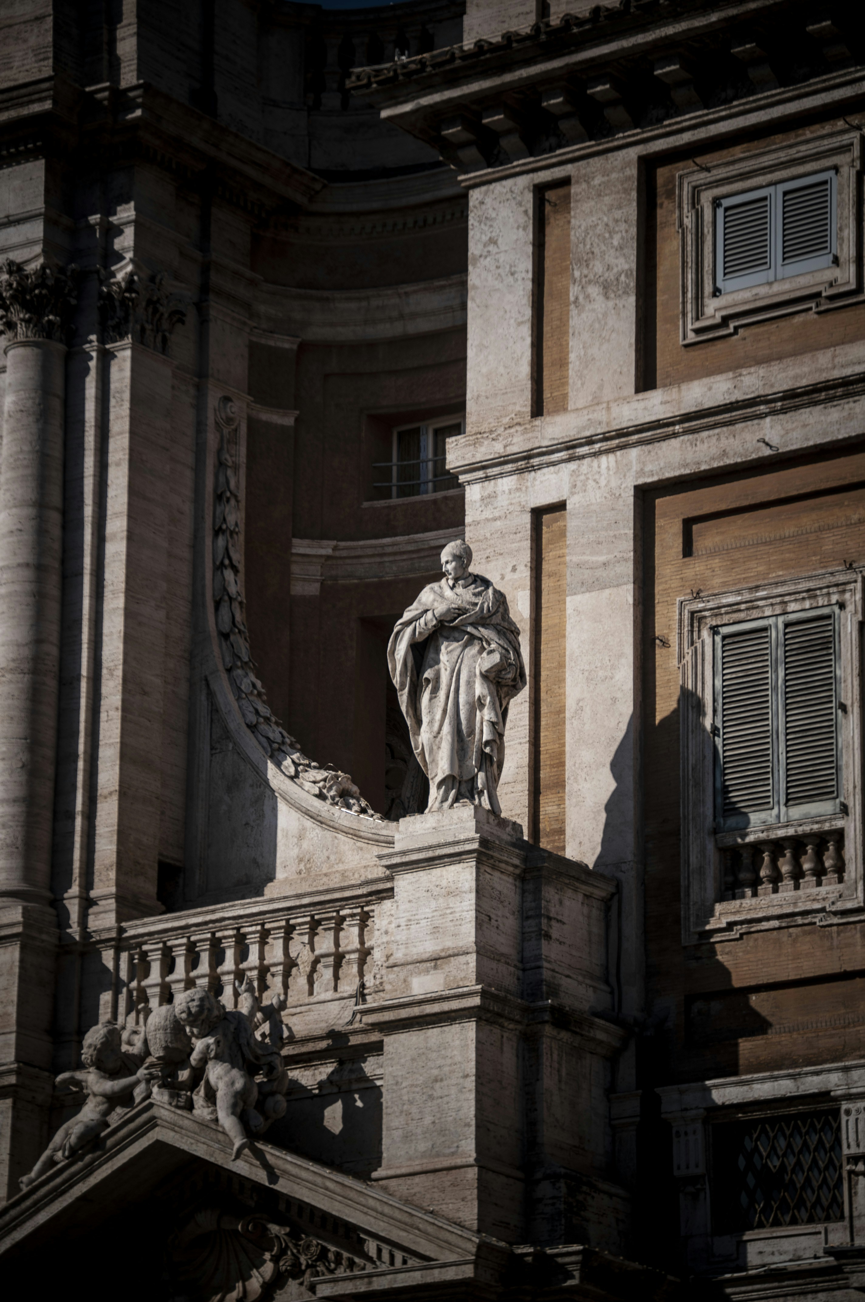 Statues on Stone: A Weathered Facade Hankering for Light