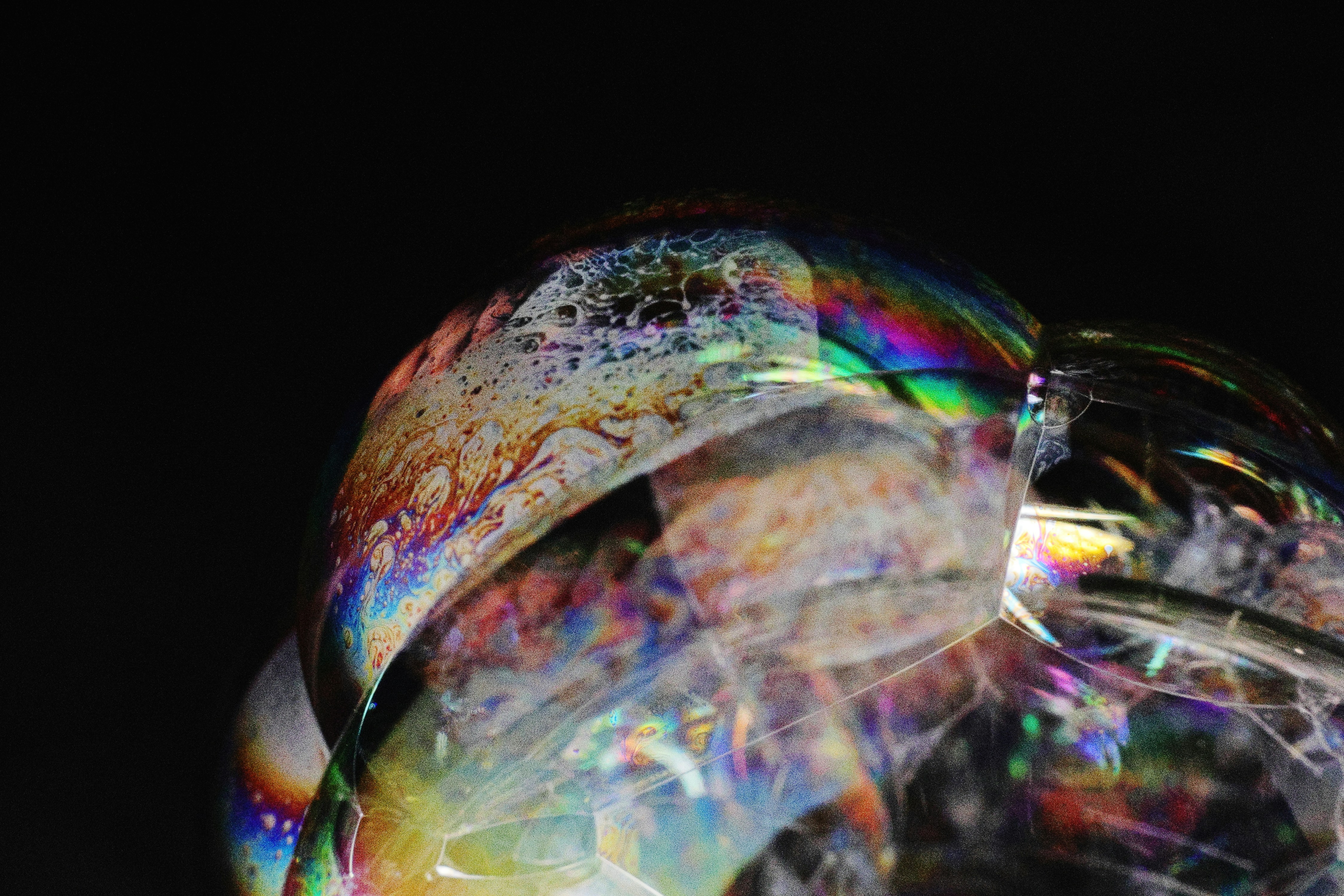 Iridescent Prism: a Close-Up on a Bubble’s Faceted Surface