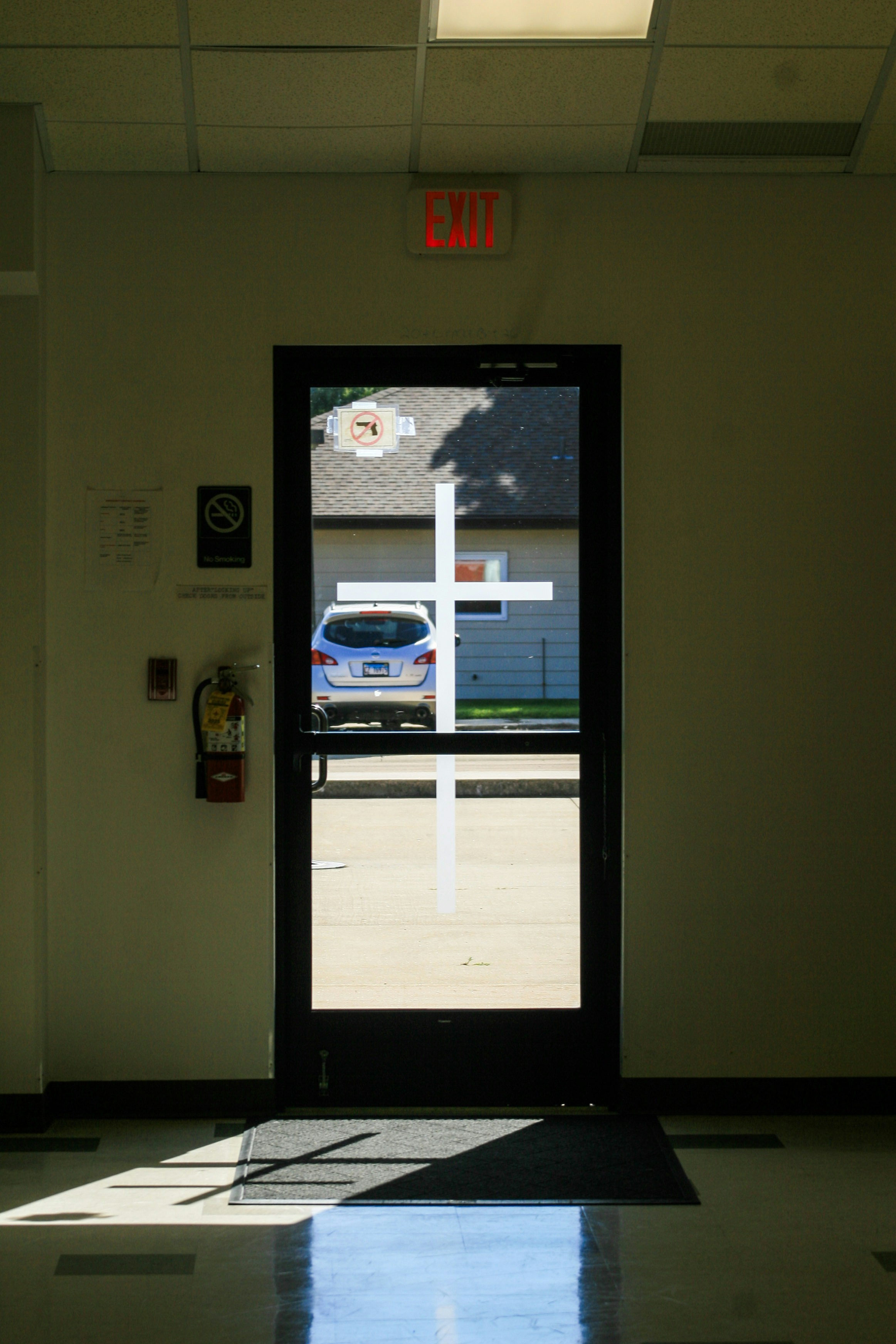 Crossroads of Light: Exit Door Framed by Daylight