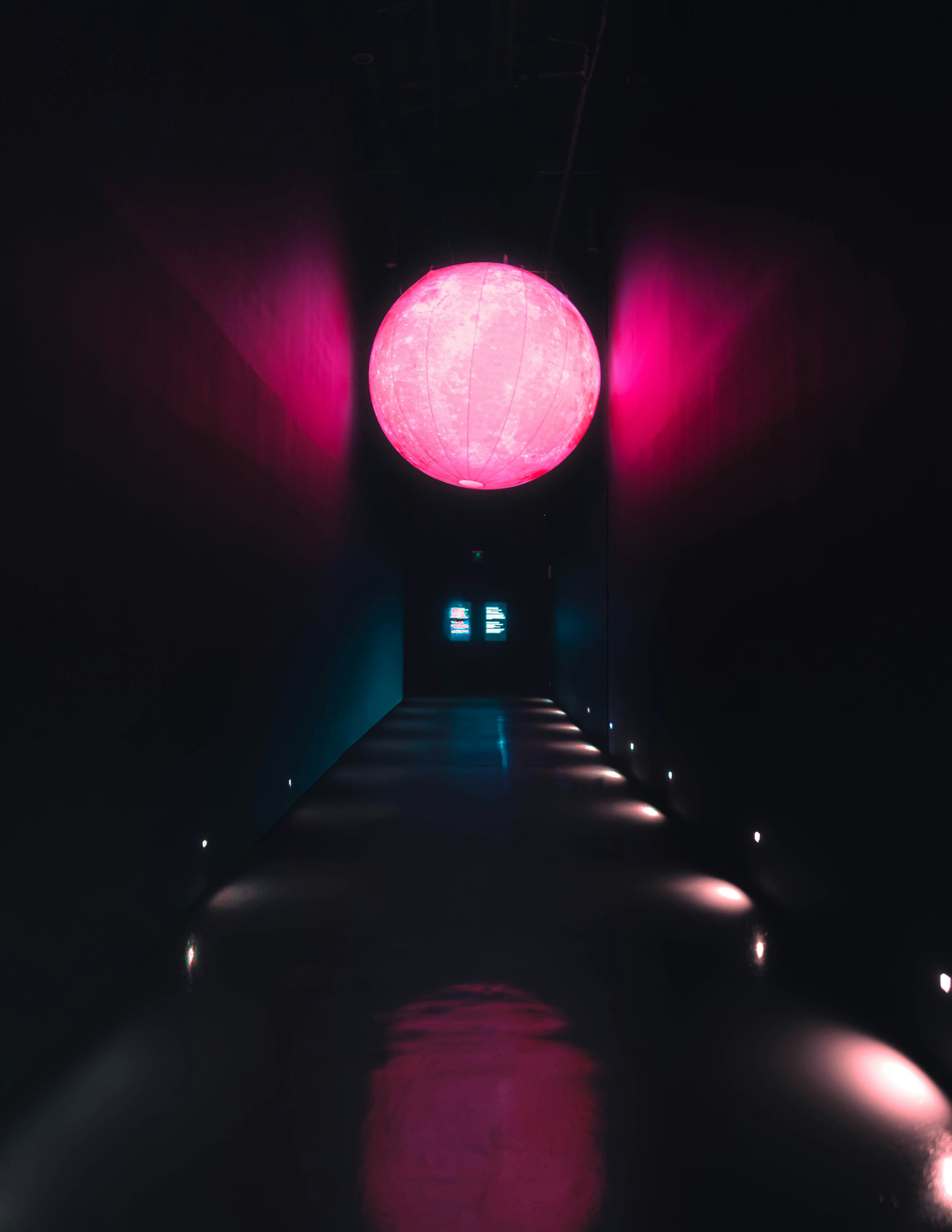 Neon Sphere Over a Quiet Neon Corridor