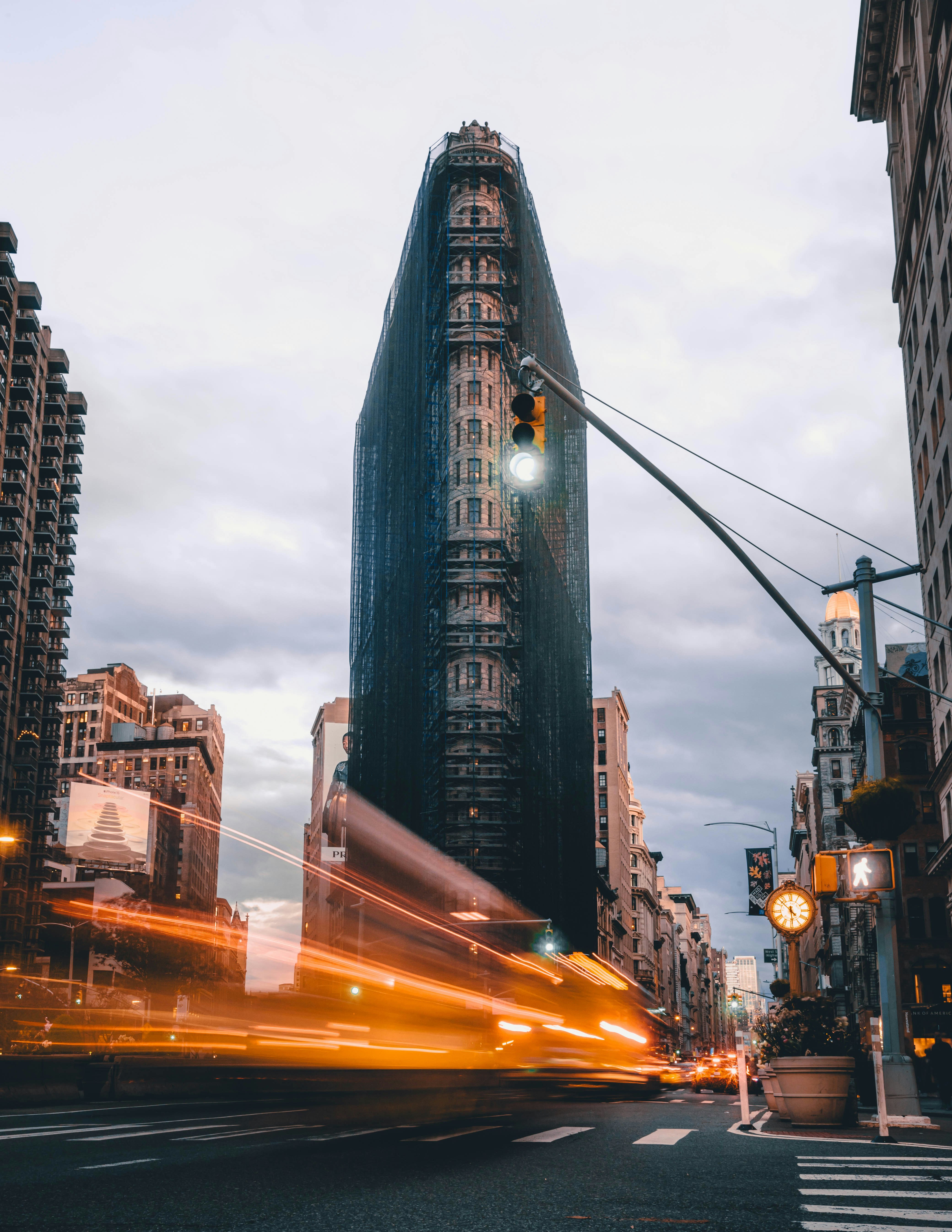 Urban Silhouette in Motion: A City’s Sinewy Skyscraper Under Neon Rail