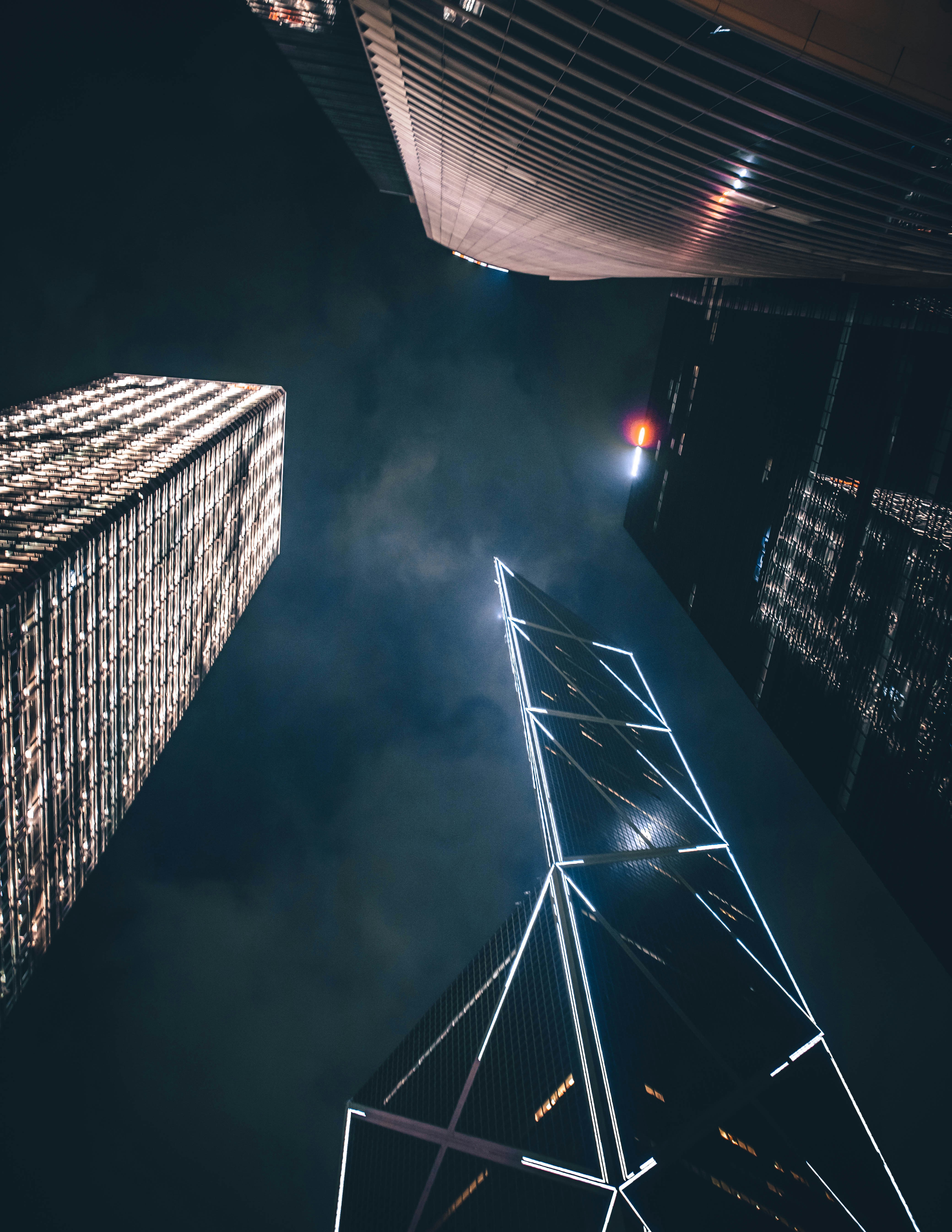Urban Skyward: Neon Lattice Against Nighttime Skyscrapers