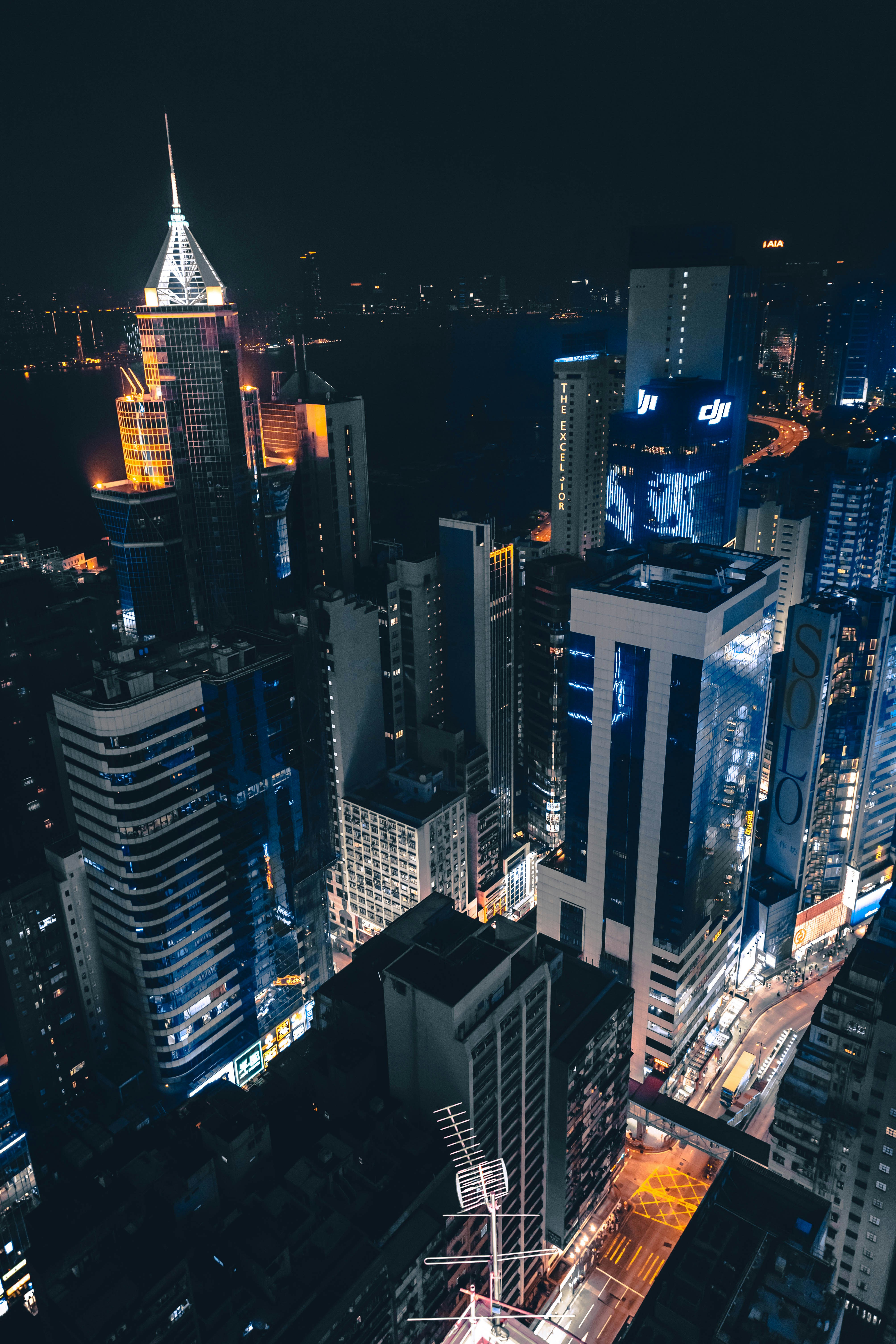 Neon Crown: A Nightscape of Towering Glass and Skyward Lines