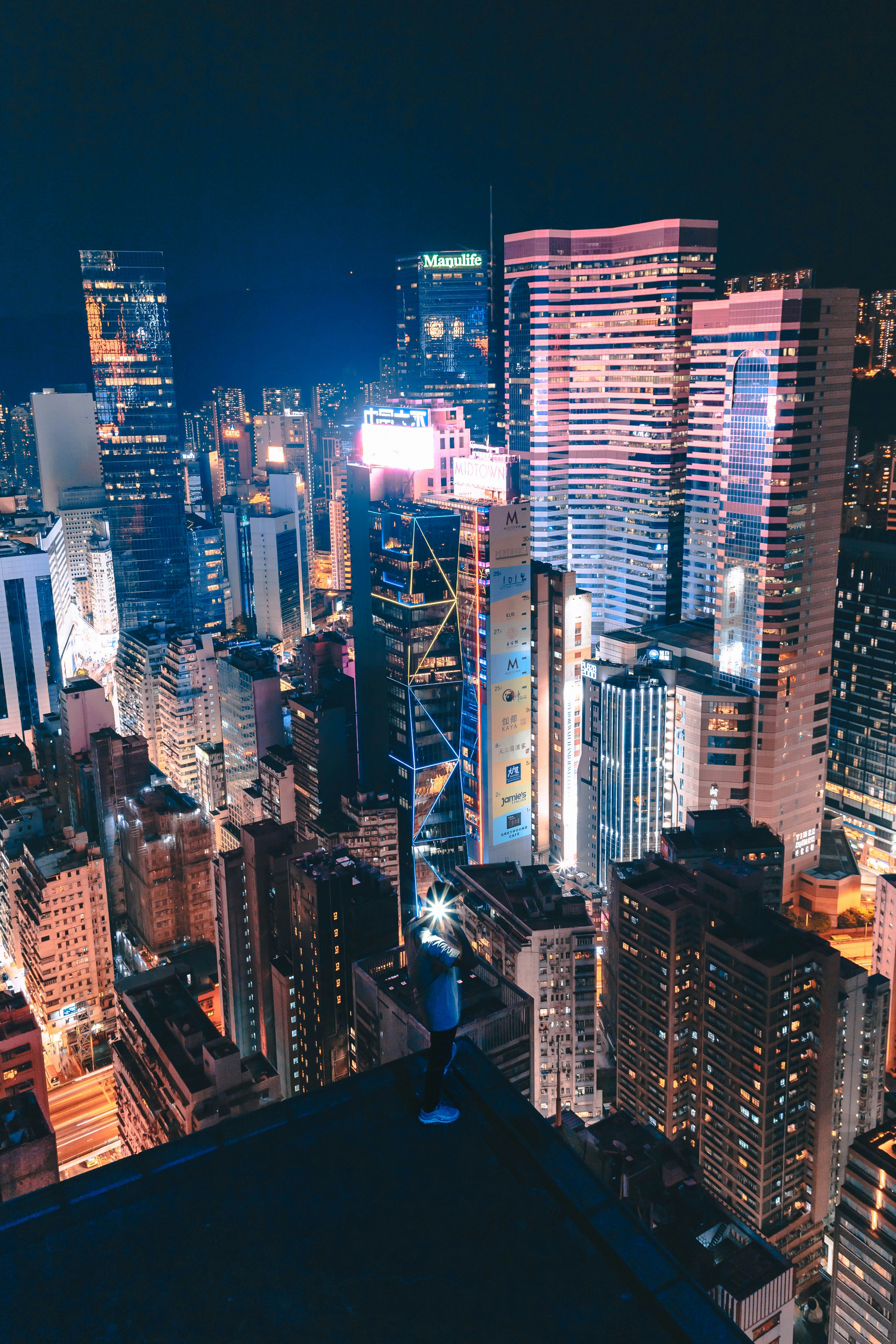 Skyline Reverie: Neon canyons from a rooftop edge