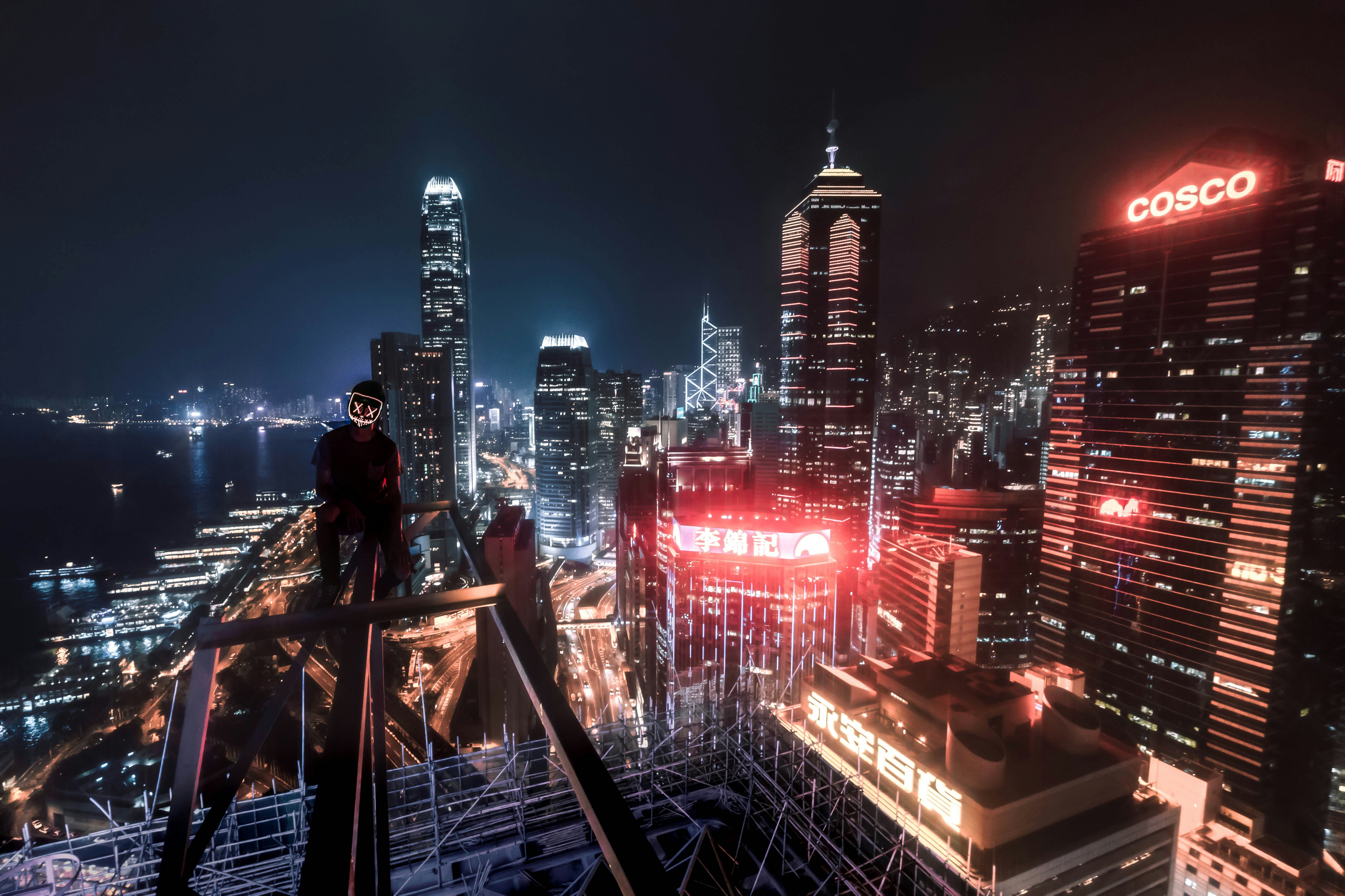 Rooftop Quiet on a Neon Skyline