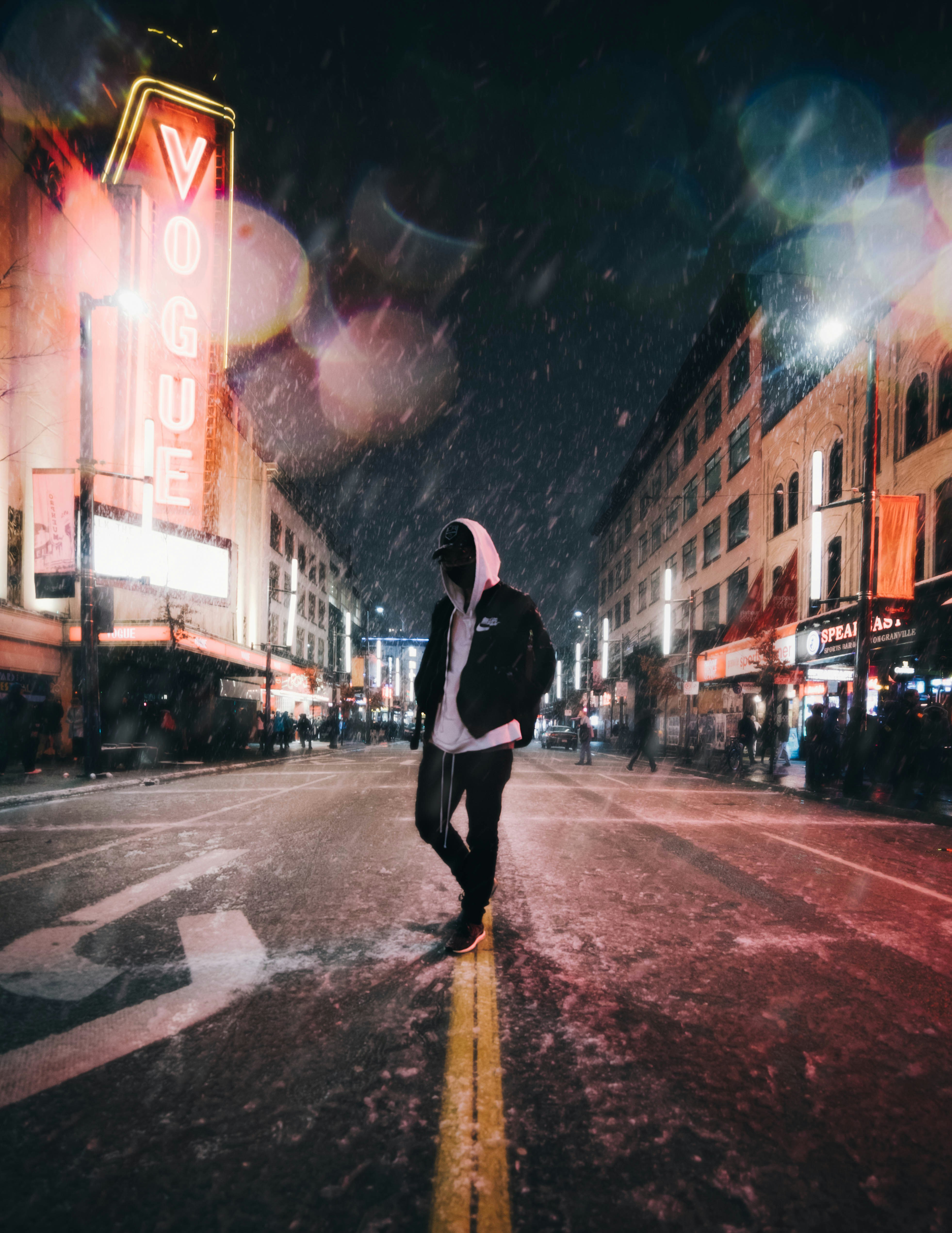 Midnight Neon Stroll on a Snow-Kissed Street