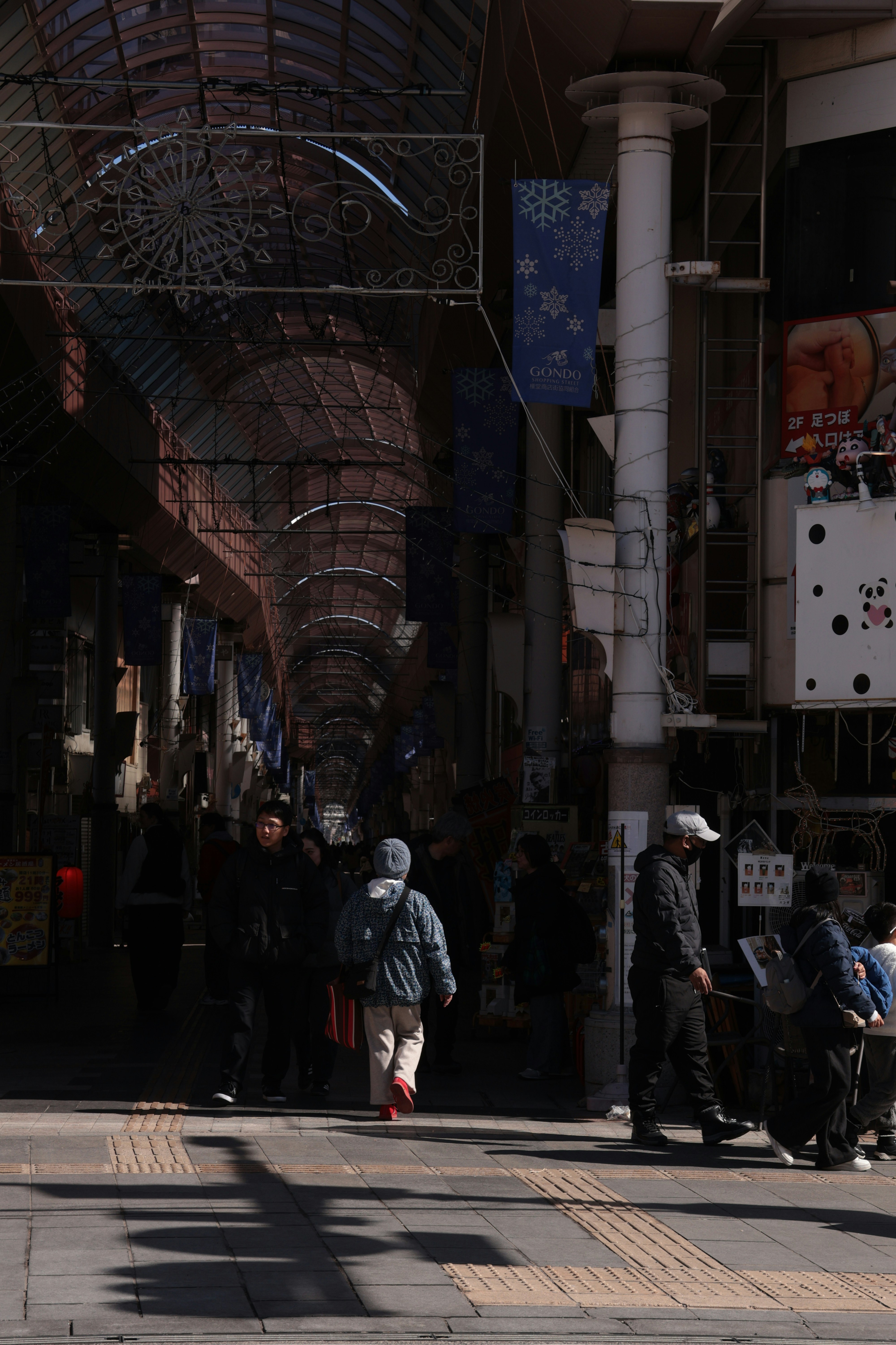 Street Arcade: Quiet Walk Beneath Winter Decor