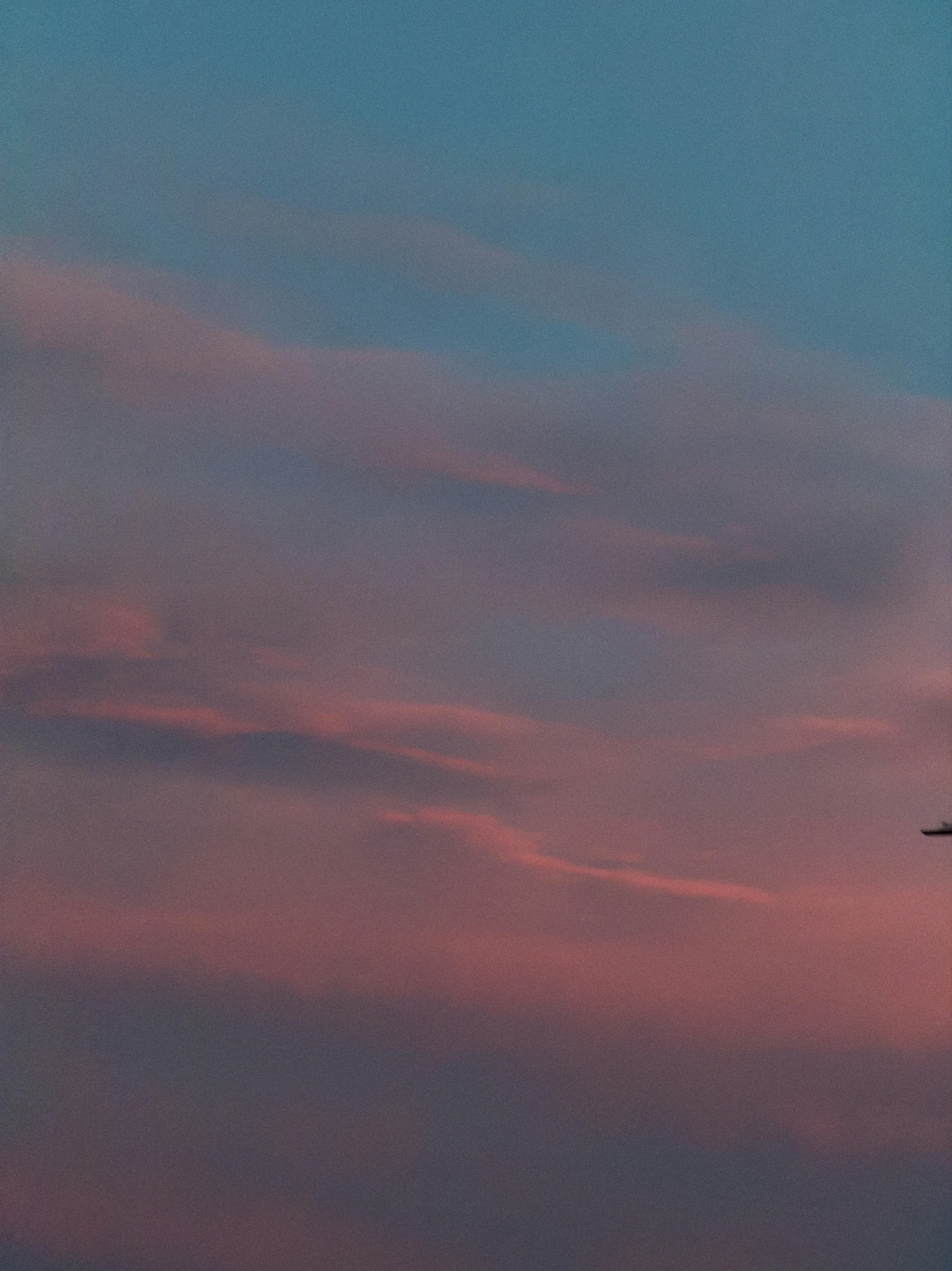 Dusk Corridor: A Sliver of Plane Against Twilight Clouds