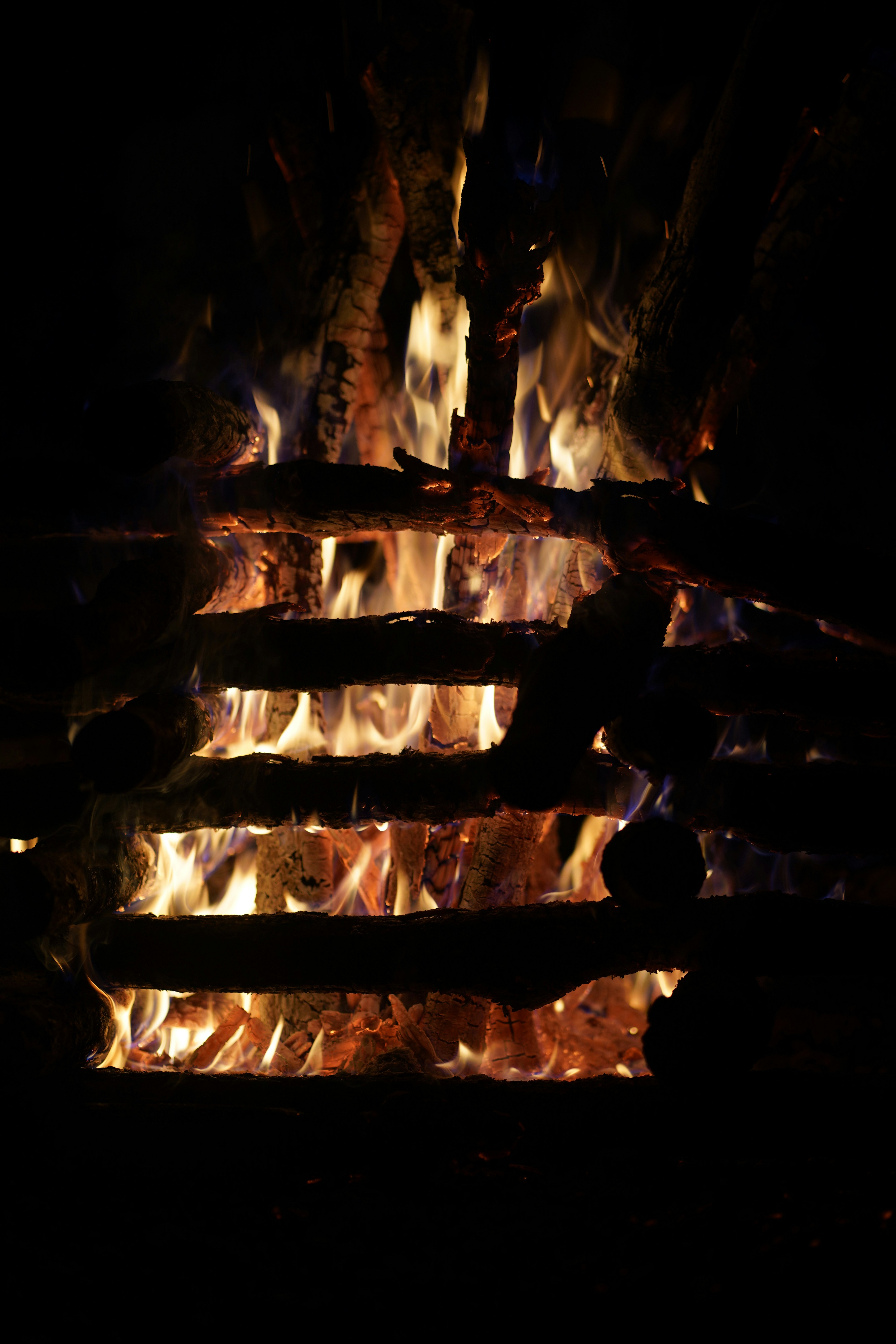 Warm Core: a Log Stack in Quiet Firelight