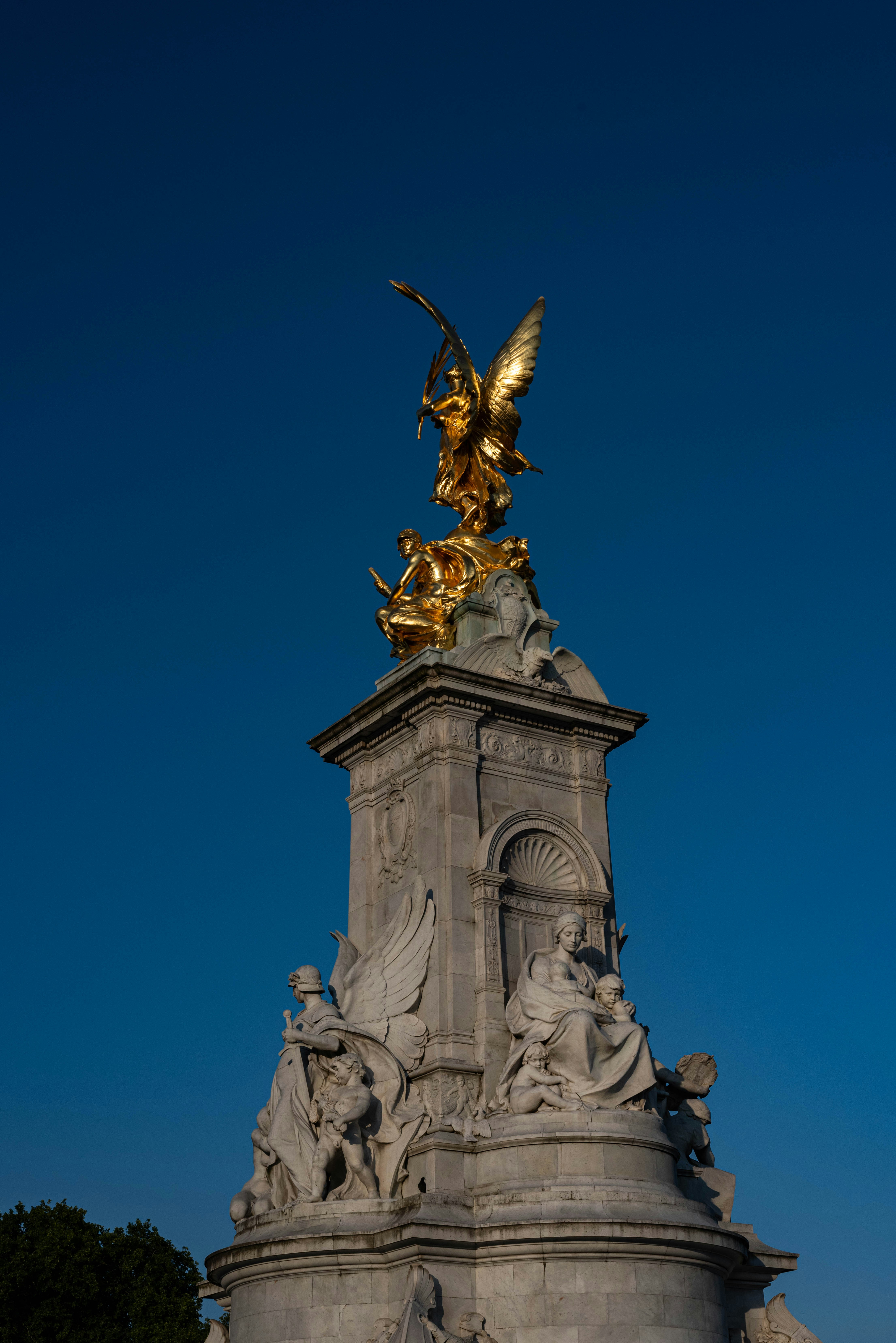Golden Winged Apex: The Victory Sculpture Against a Cerulean Sky