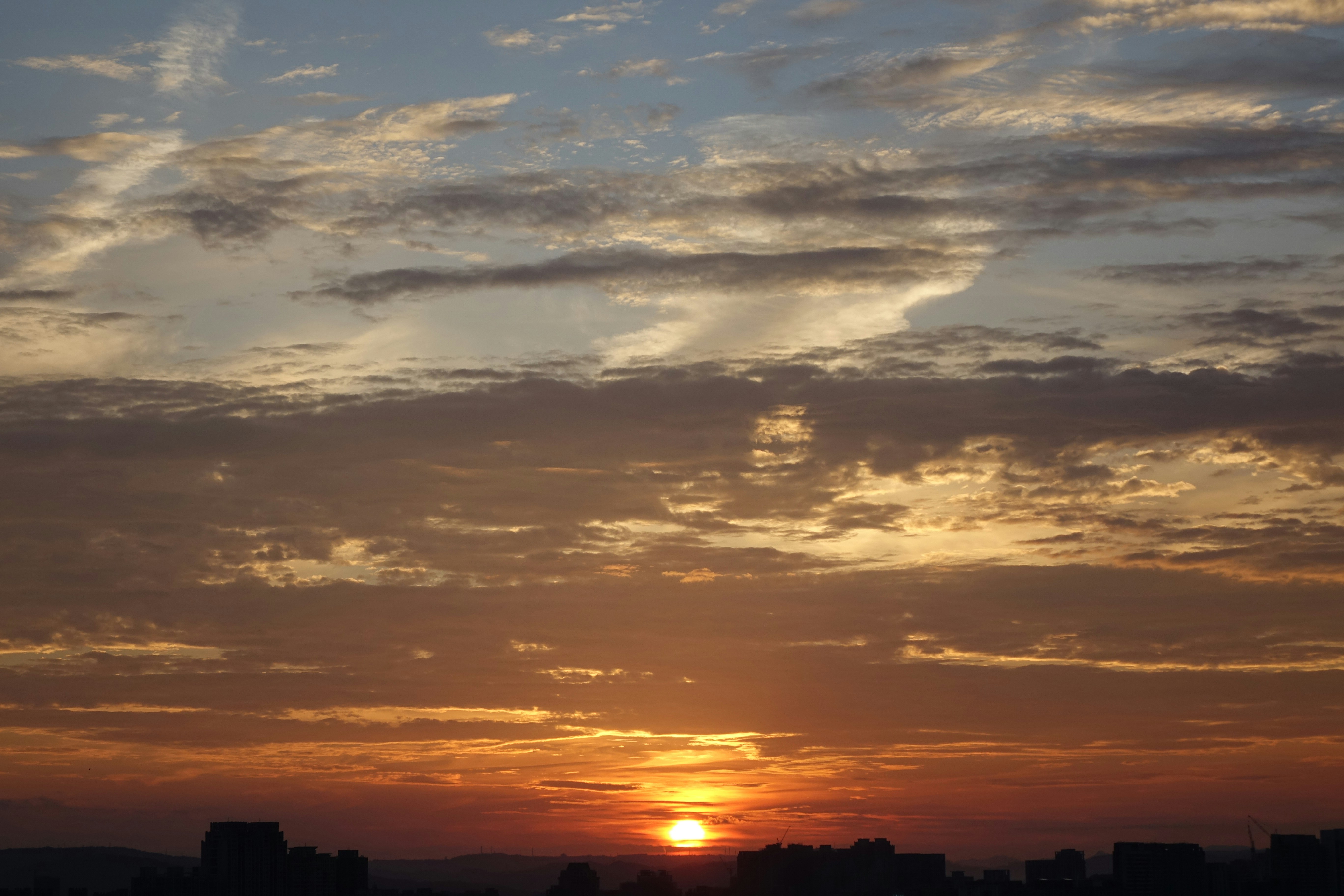Sunset Over the Horizon: A Quiet City Silhouette