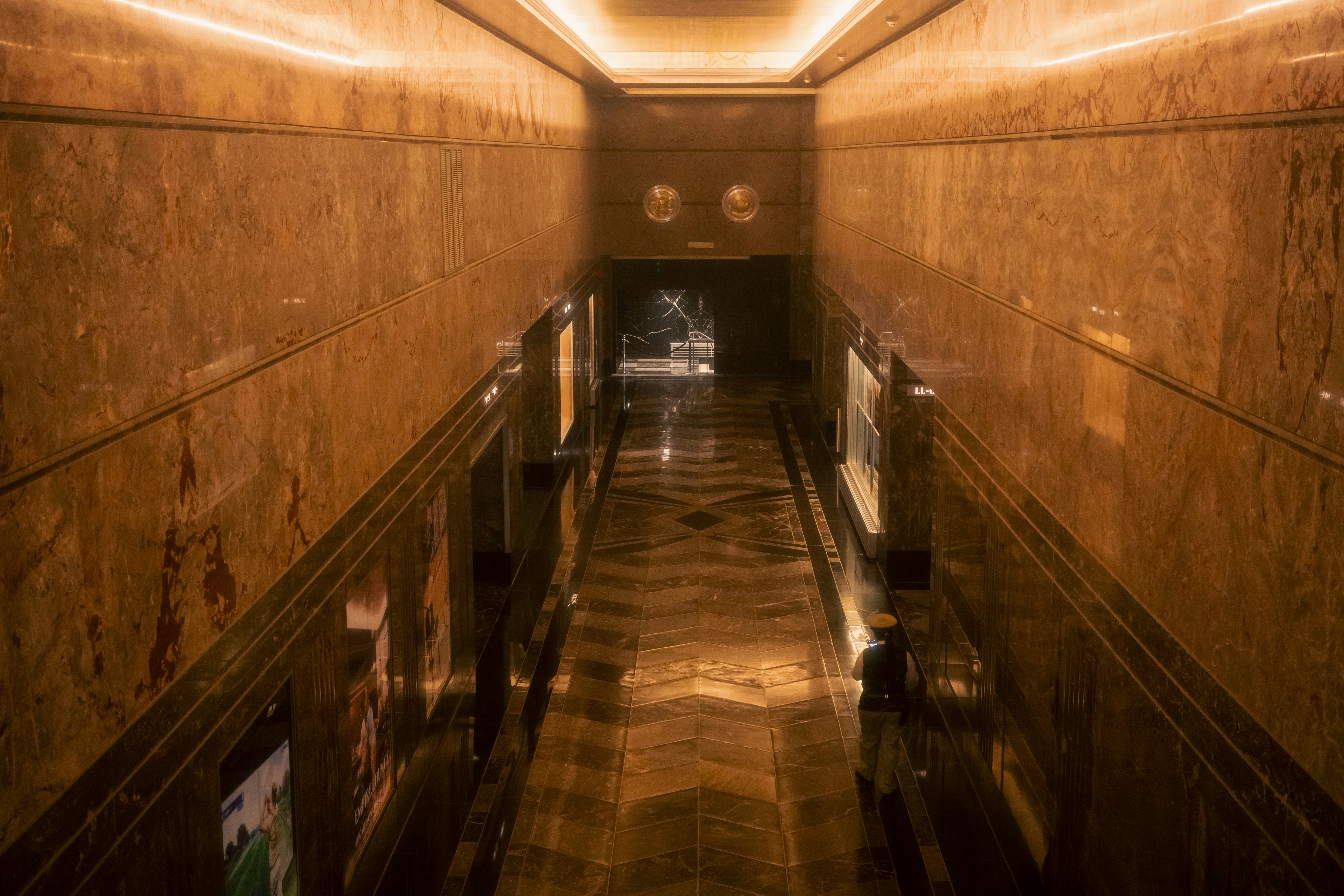 Echoes of Marble: Quiet Corridor in Warm Bronze