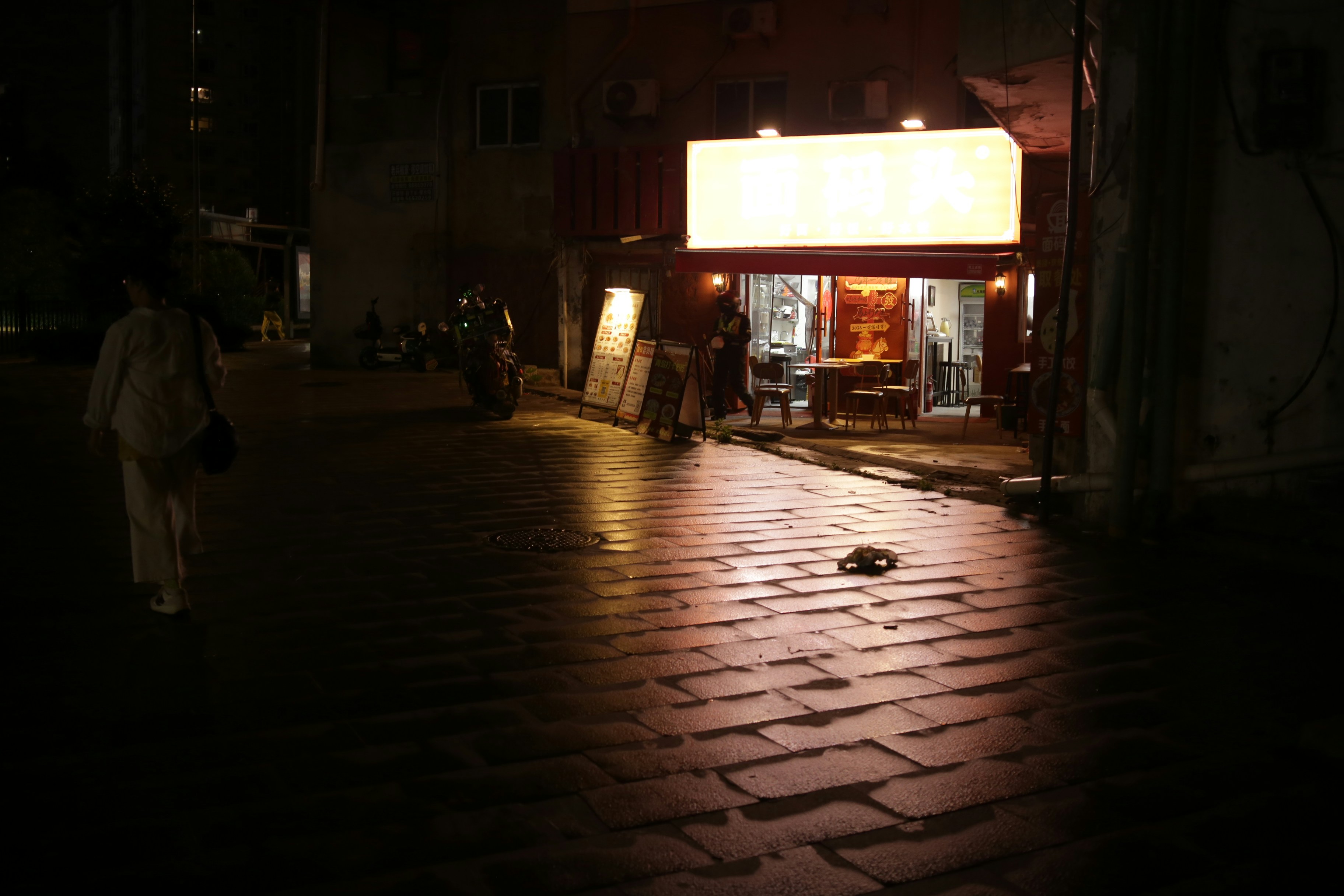 Night Neon in Quiet Alley: Warm Glow and Wet Cobblestones
