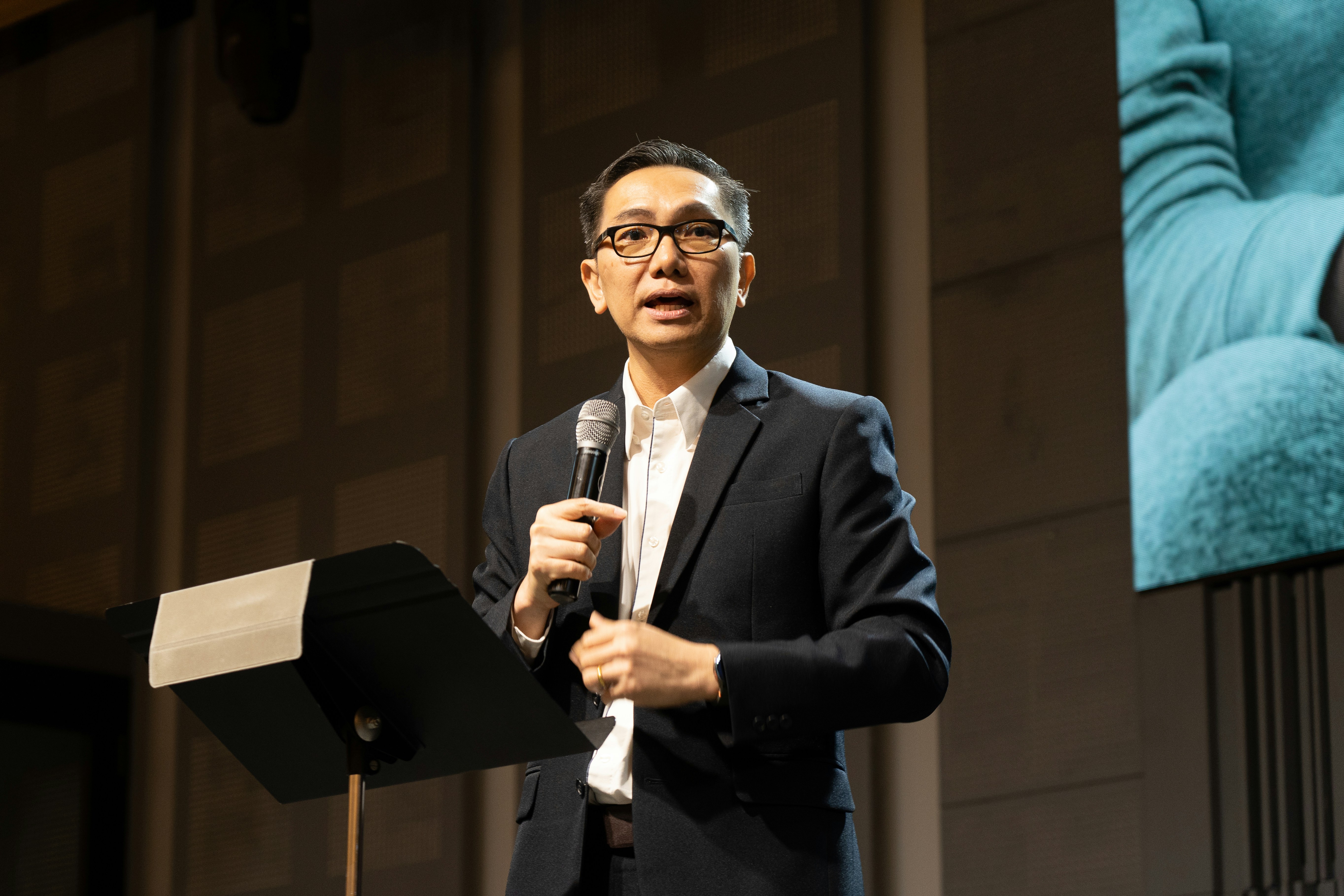 Speaker at the Podium: A Formal Address on Stage