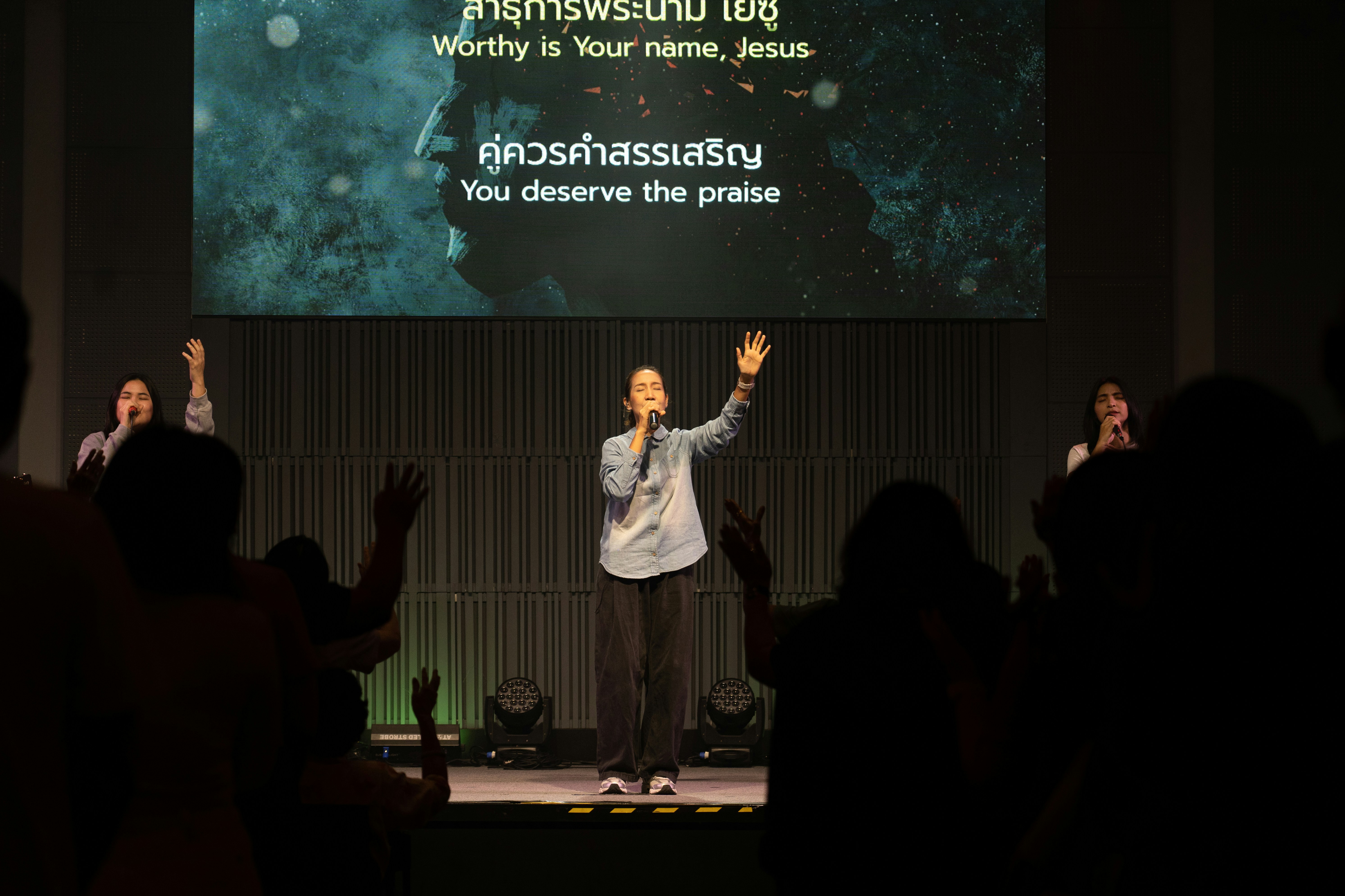 Center Stage: A Solo Vocalist Leads a Quiet Moment of Praise
