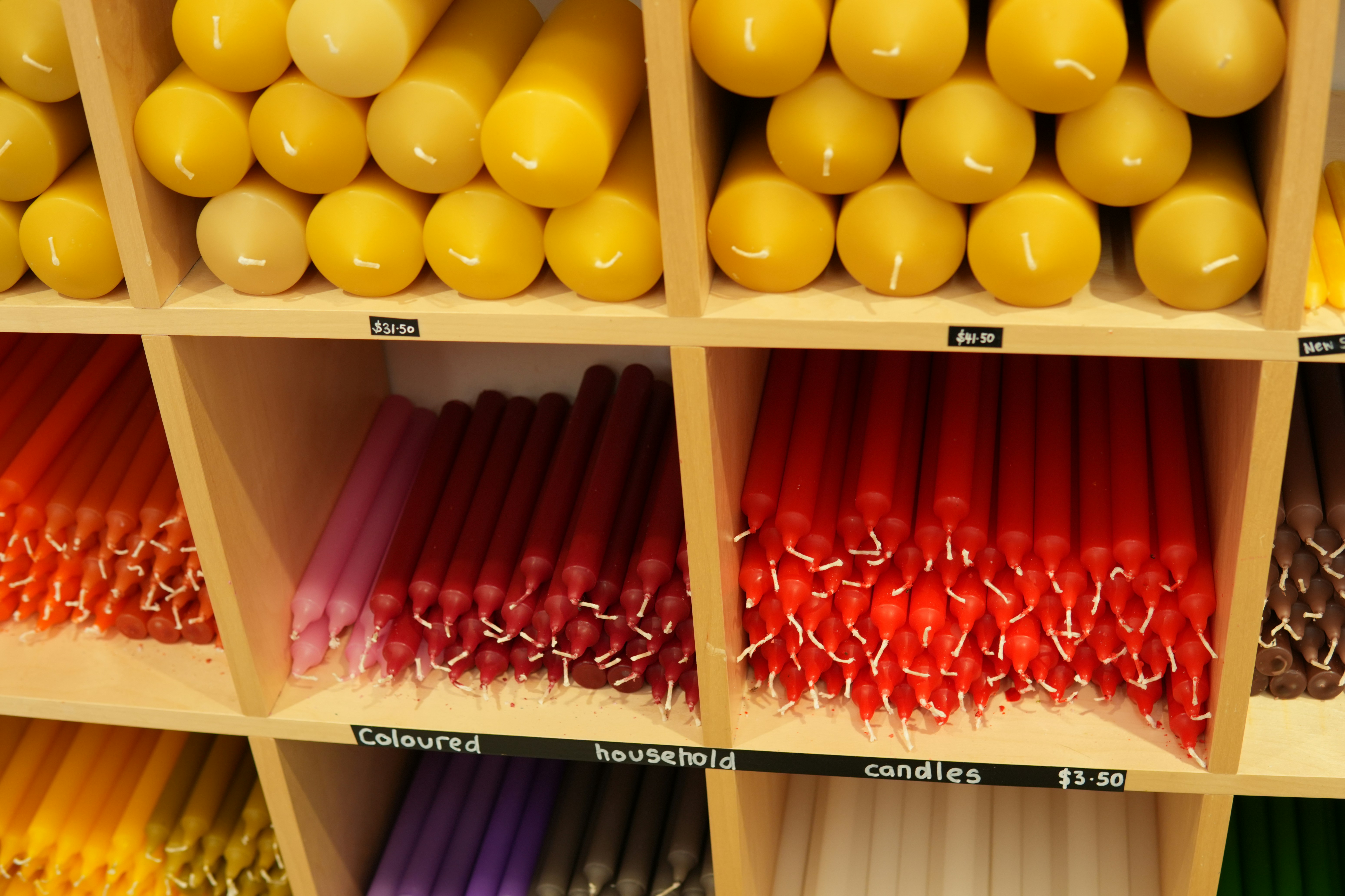 Colorful Display of Wax Tuns in a Craft Shop Shelf