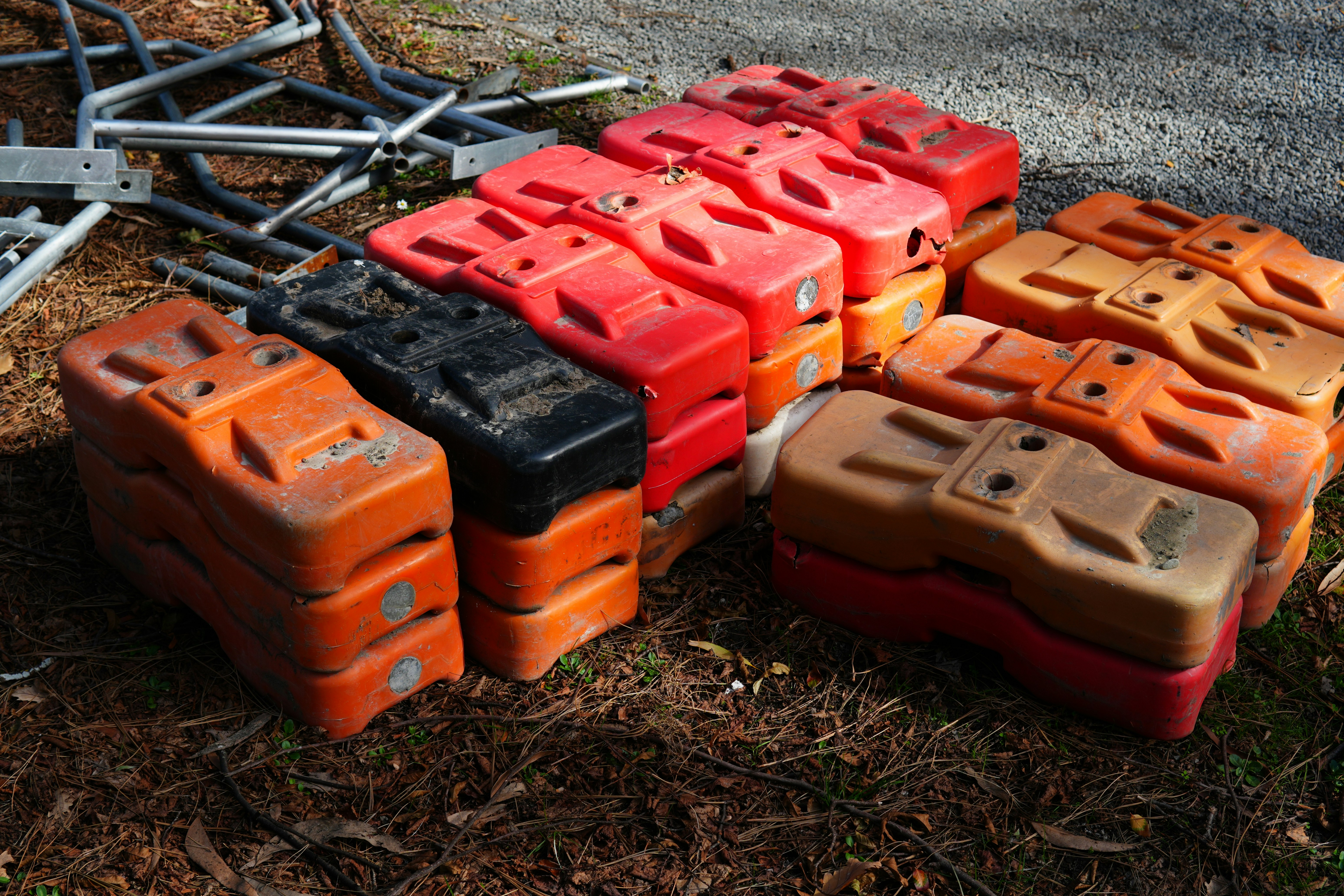 Stacked Utility: Weathered Fuel Cans in a Quiet Outdoor Scene