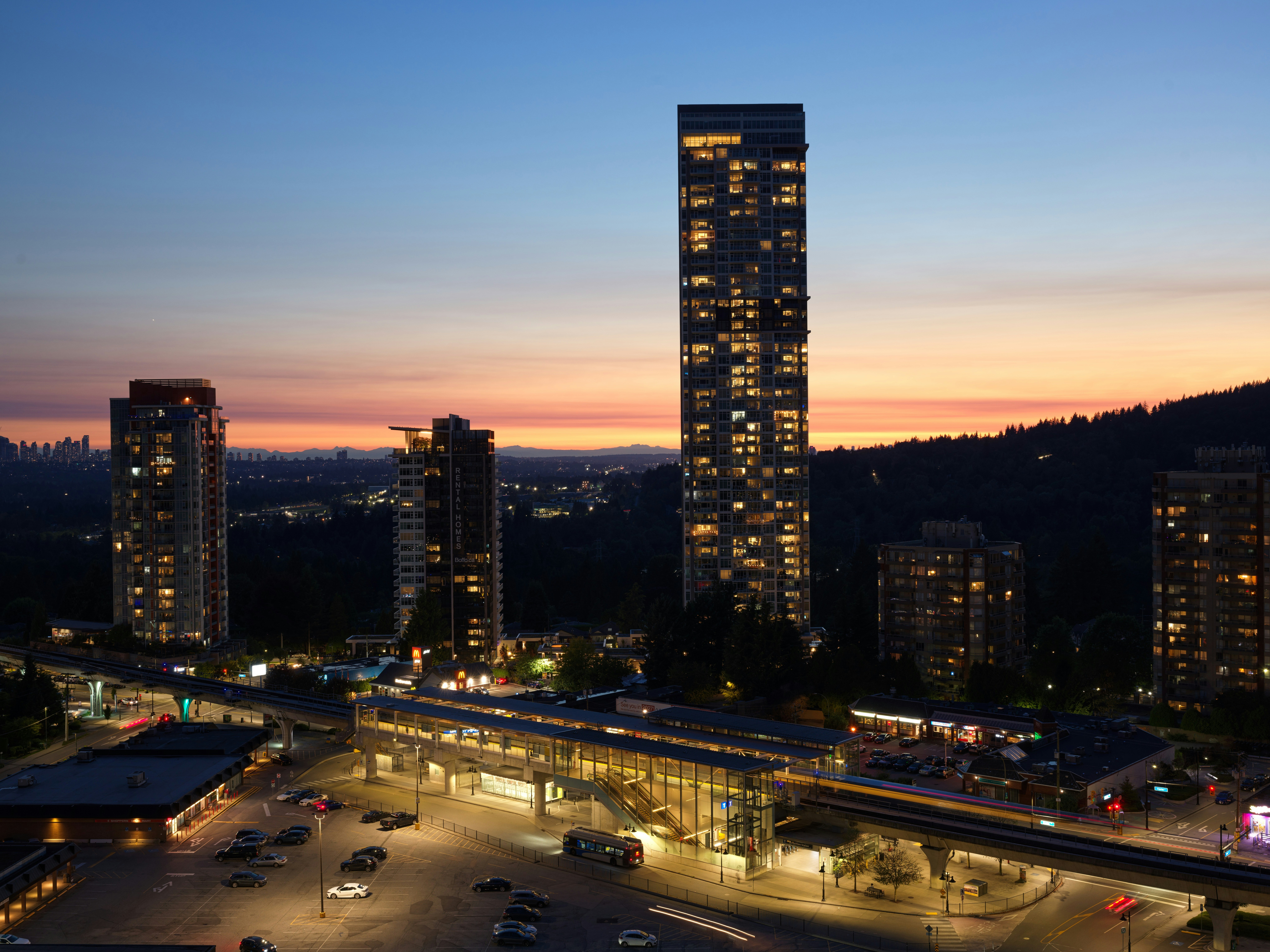 Dawn Skyline: Glass Tower Rising Over a Quiet Cityscape