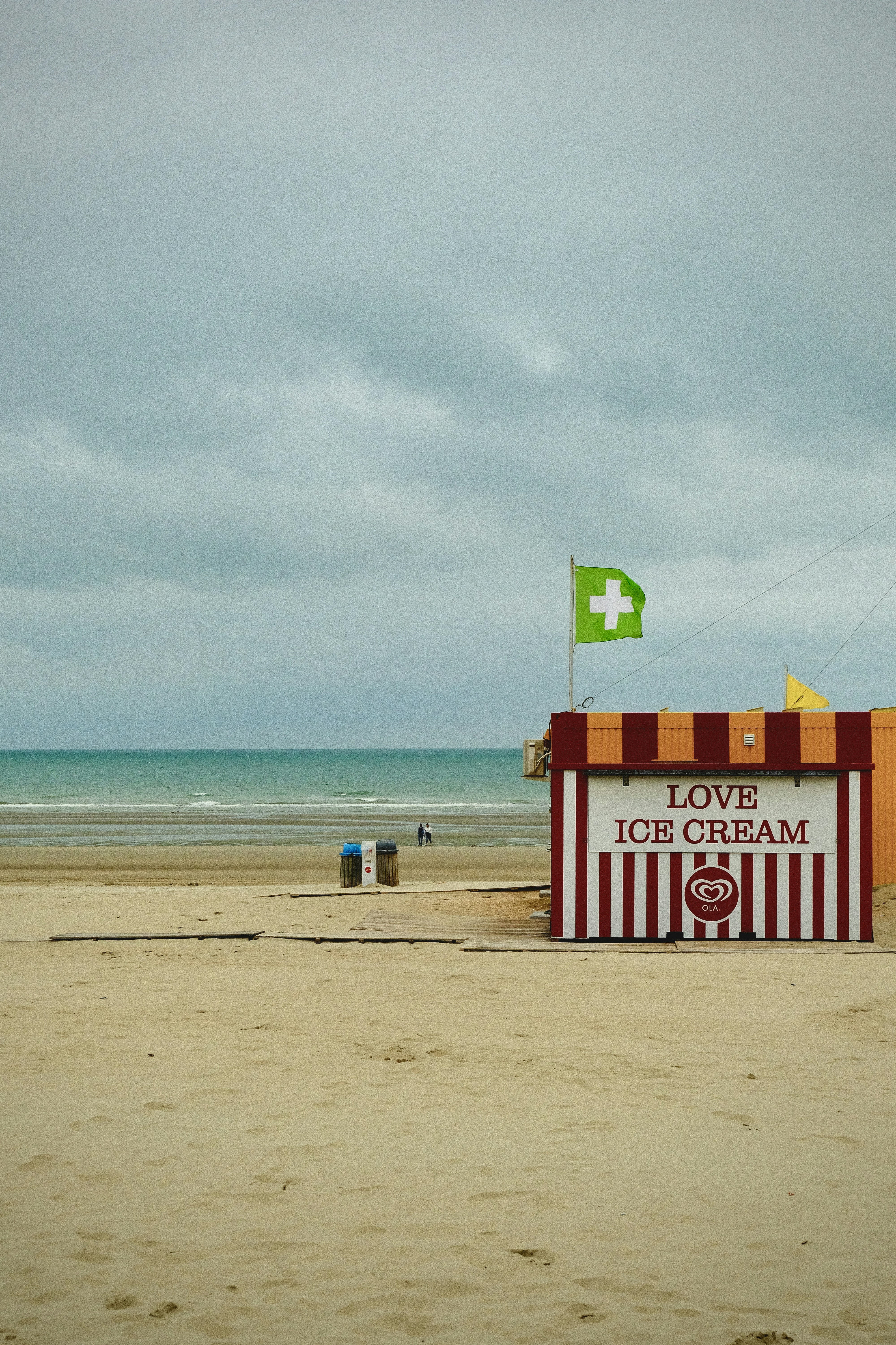 Strawberry-Colored Stall by the Seaside: Ice Cream on a Quiet Beach