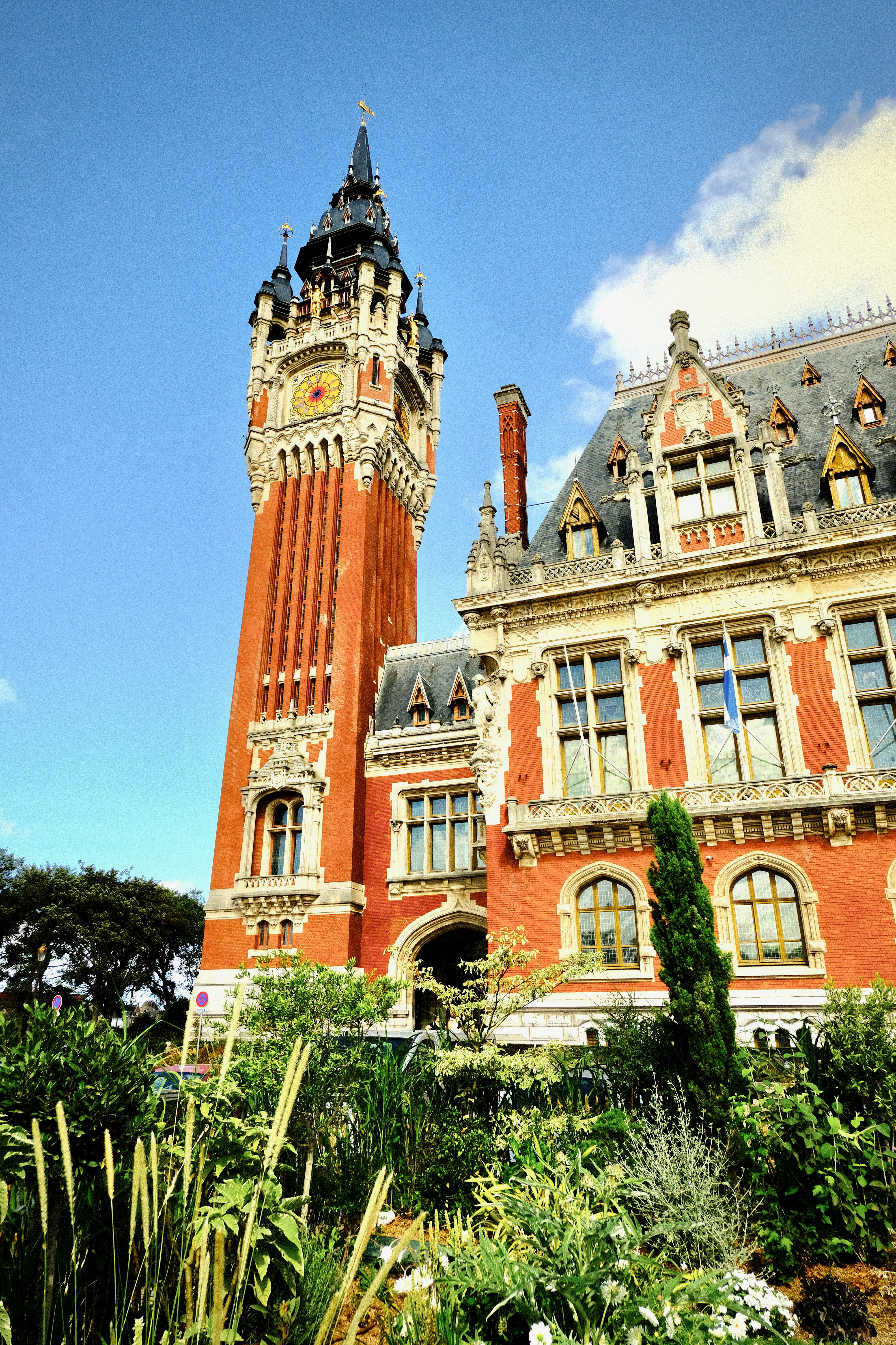 Gothic Clocktower Rising Above Red-Brick Campus Facade