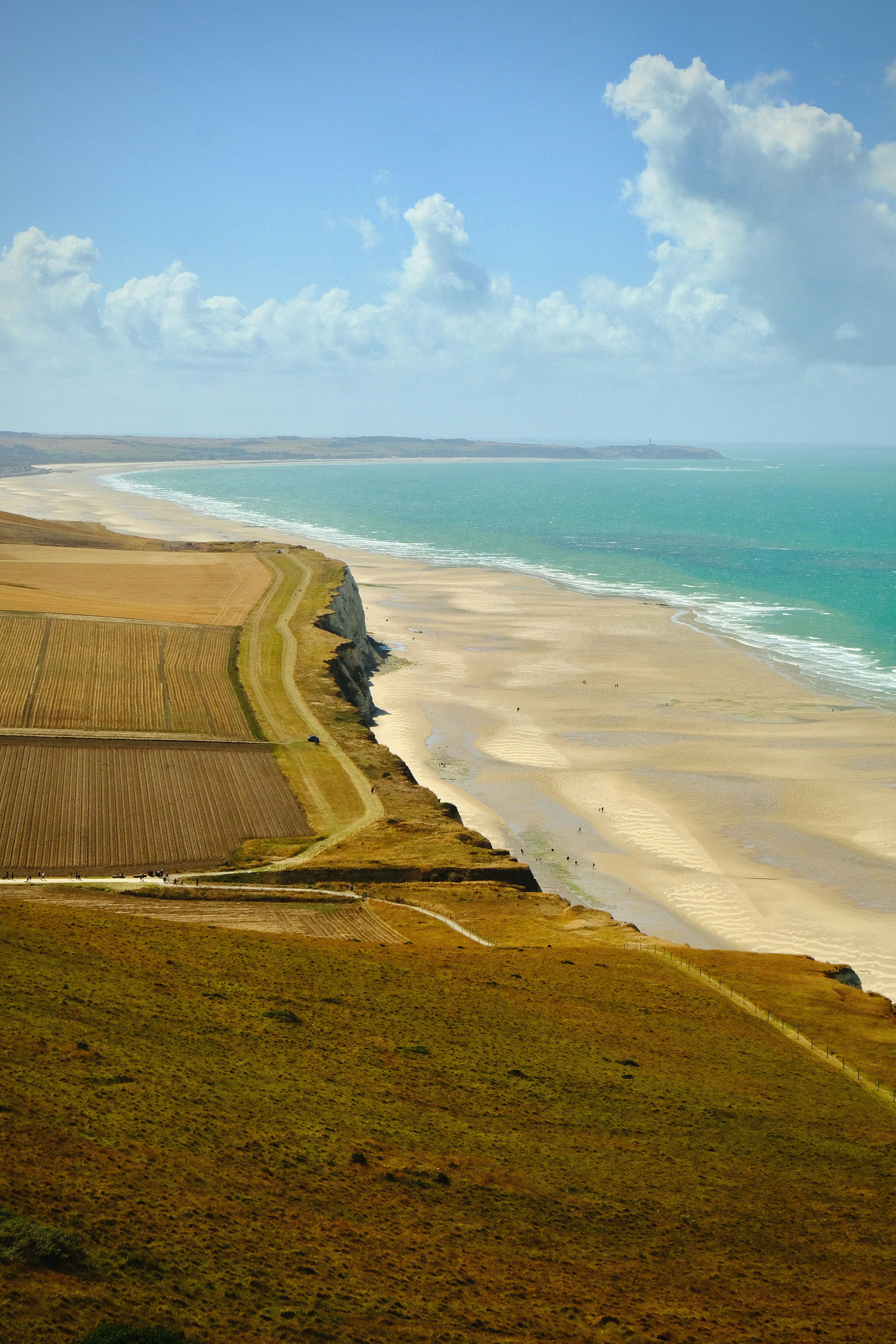 Coastal Terrace: A Sea-Breeze Horizon Above Tilled Fields