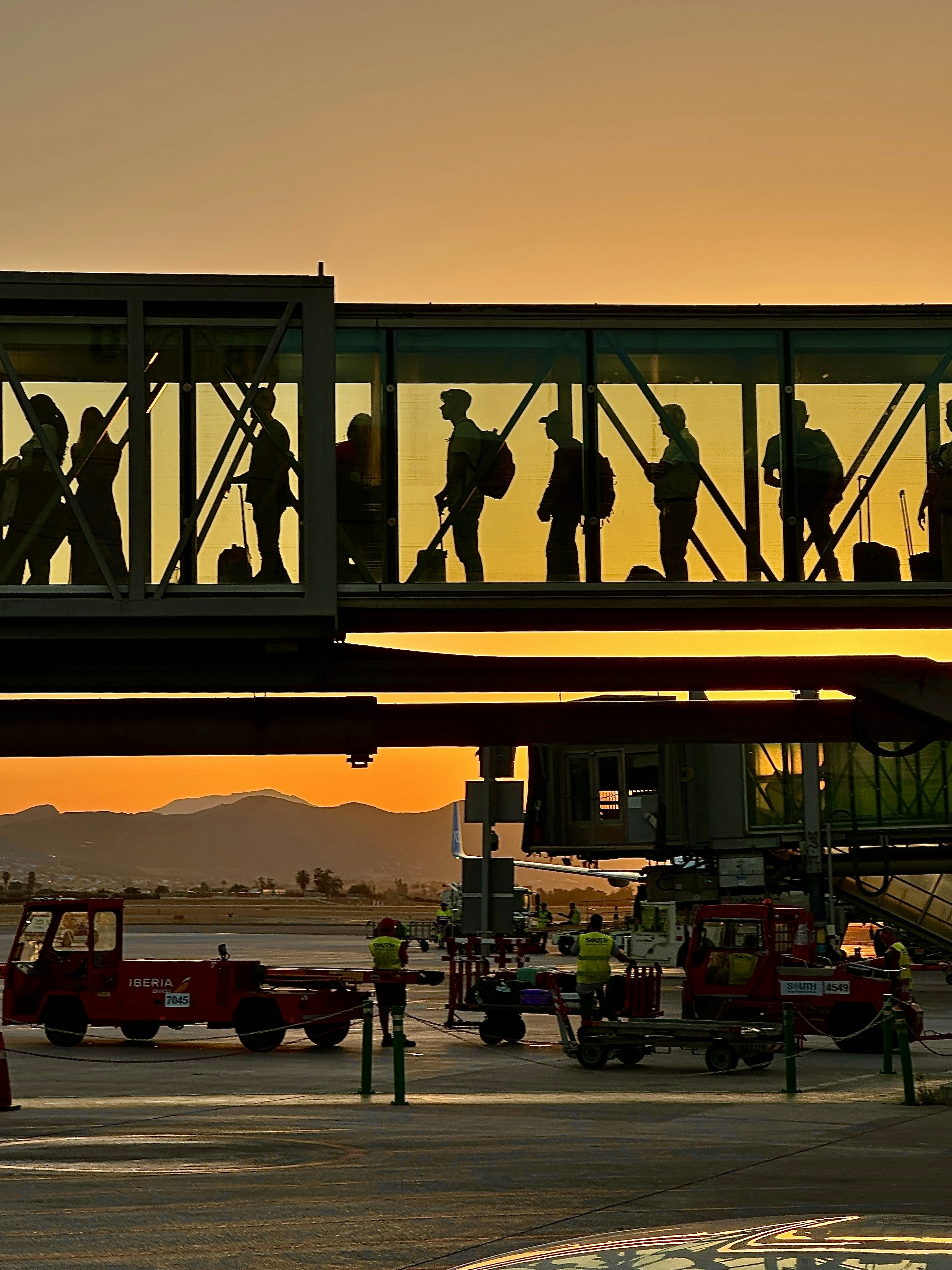 Silhouetted Jetway Ensemble at Sunset