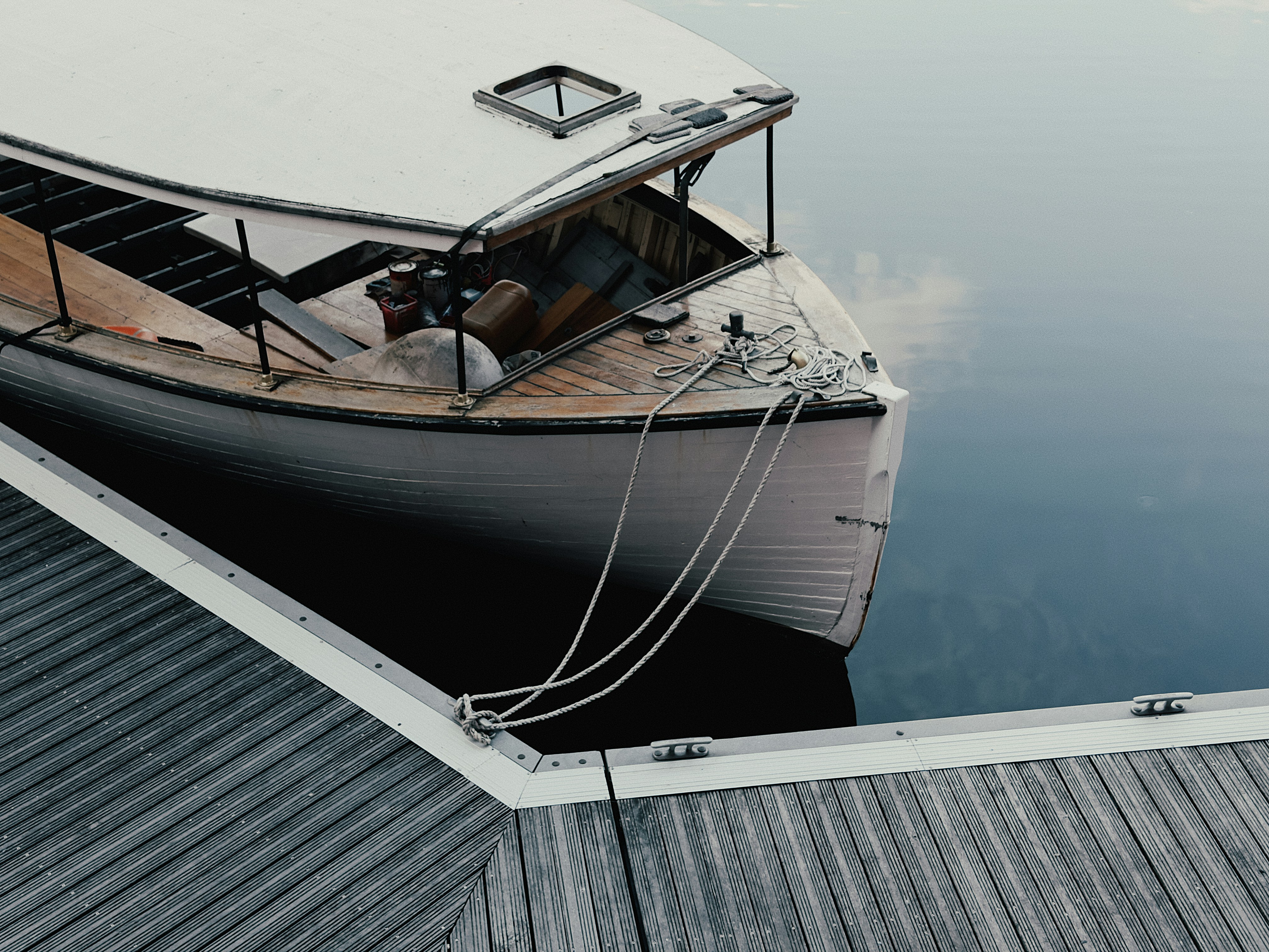 Docked Classic: A Quiet Boat Anchored at the Edge of Silence