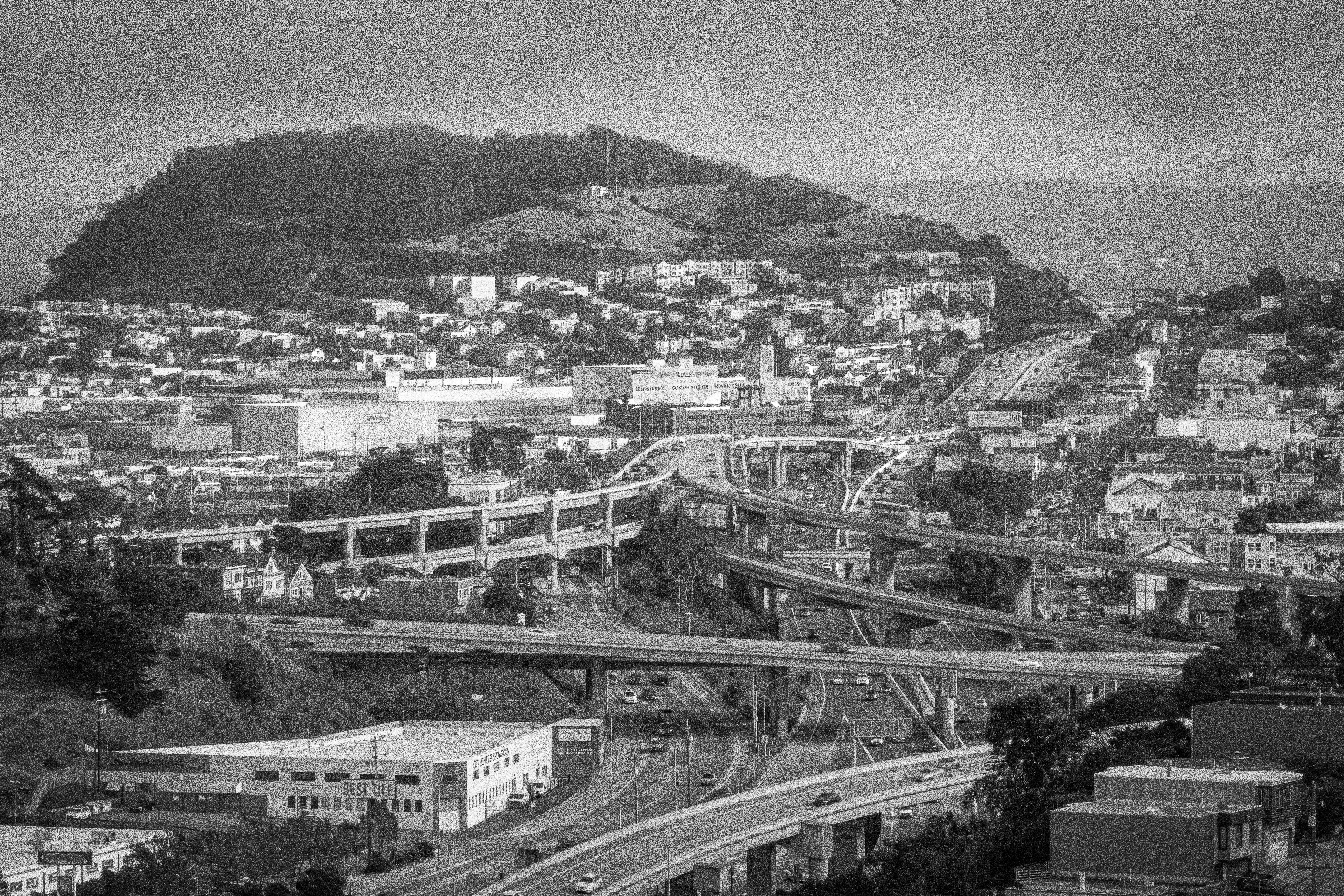 Urban Skyways: A Concrete Labyrinth Over a Hill City
