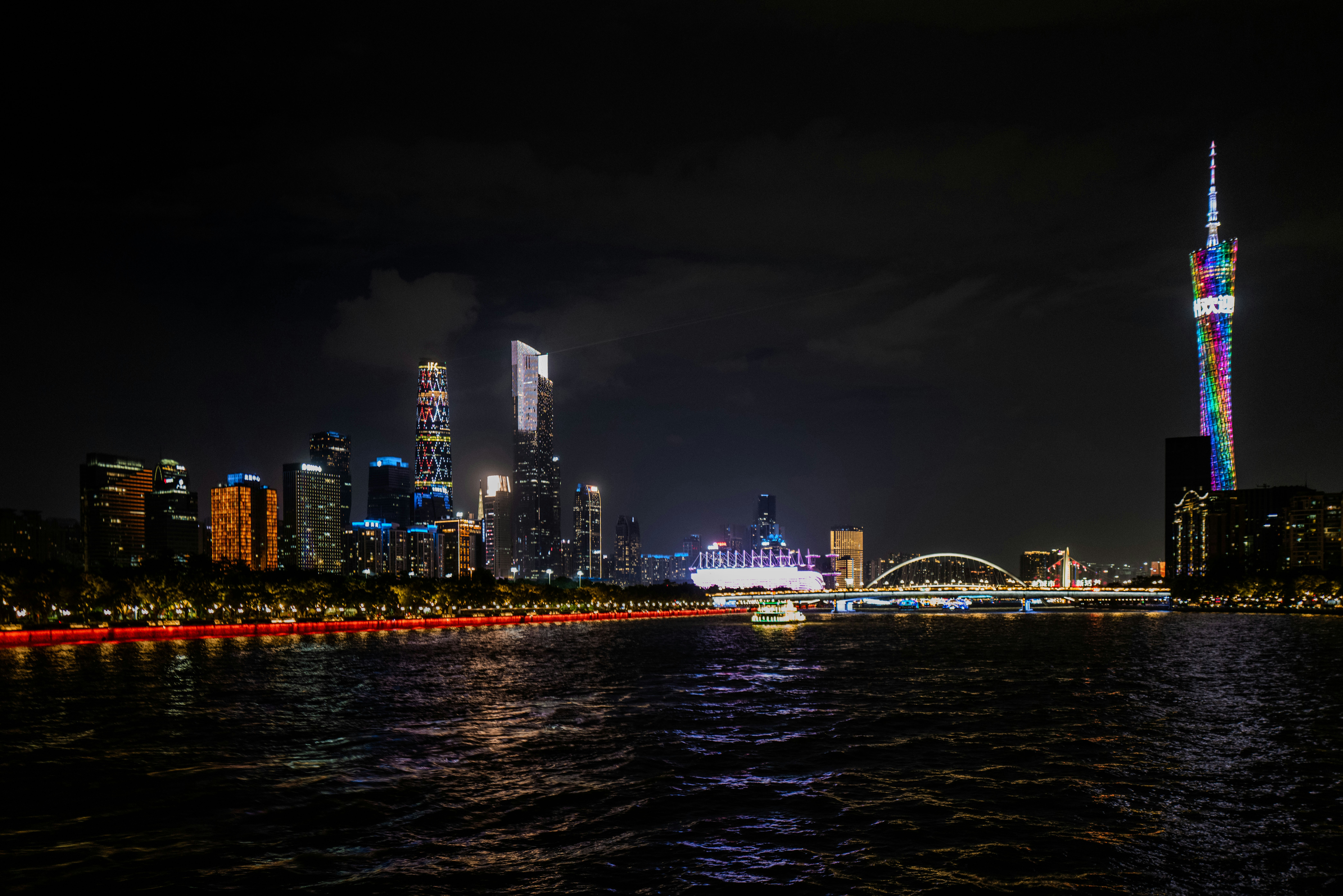 Midnight Skyline: Neon River Reflections