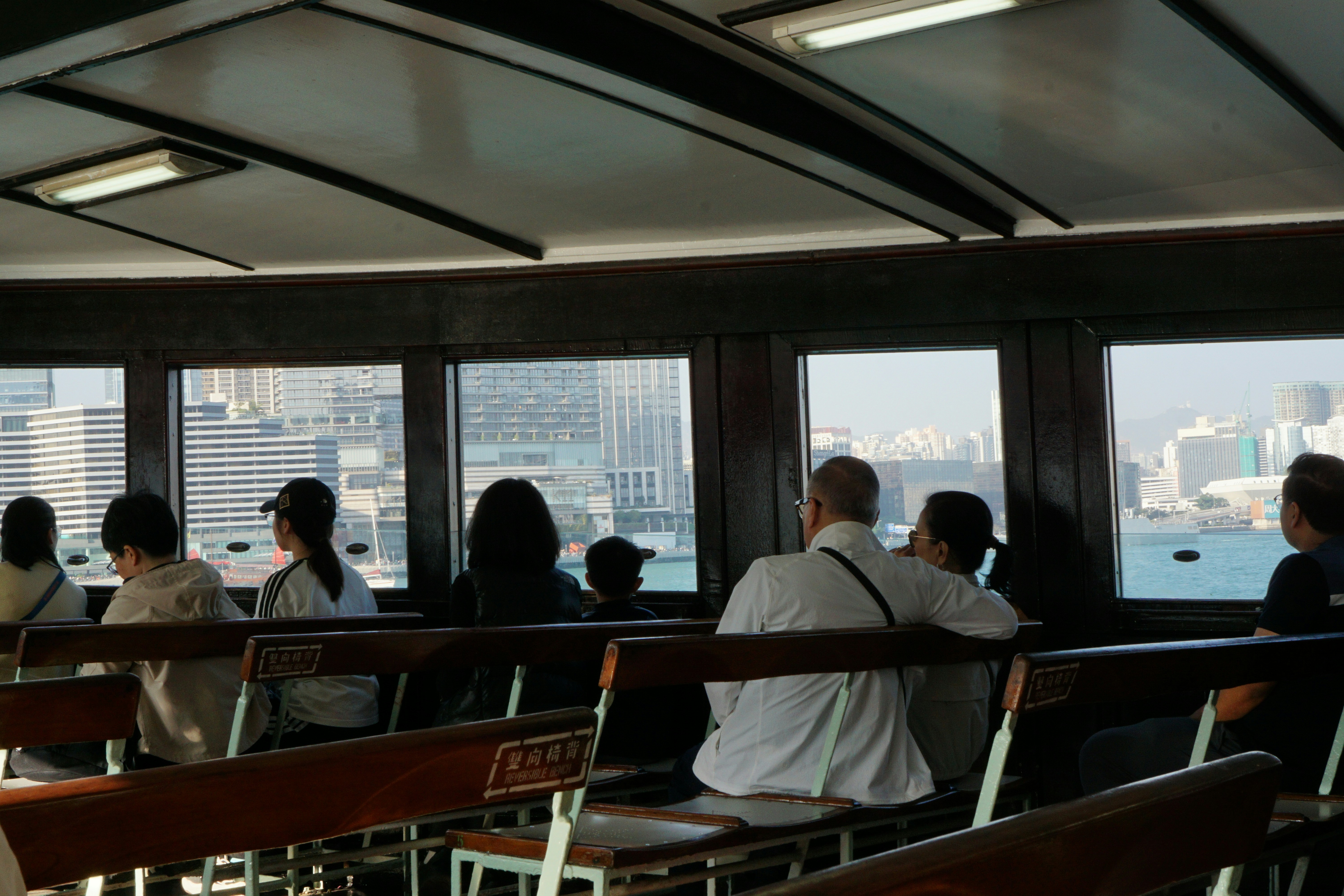 Passengers Adrift: Cityscape through the Ferry Window